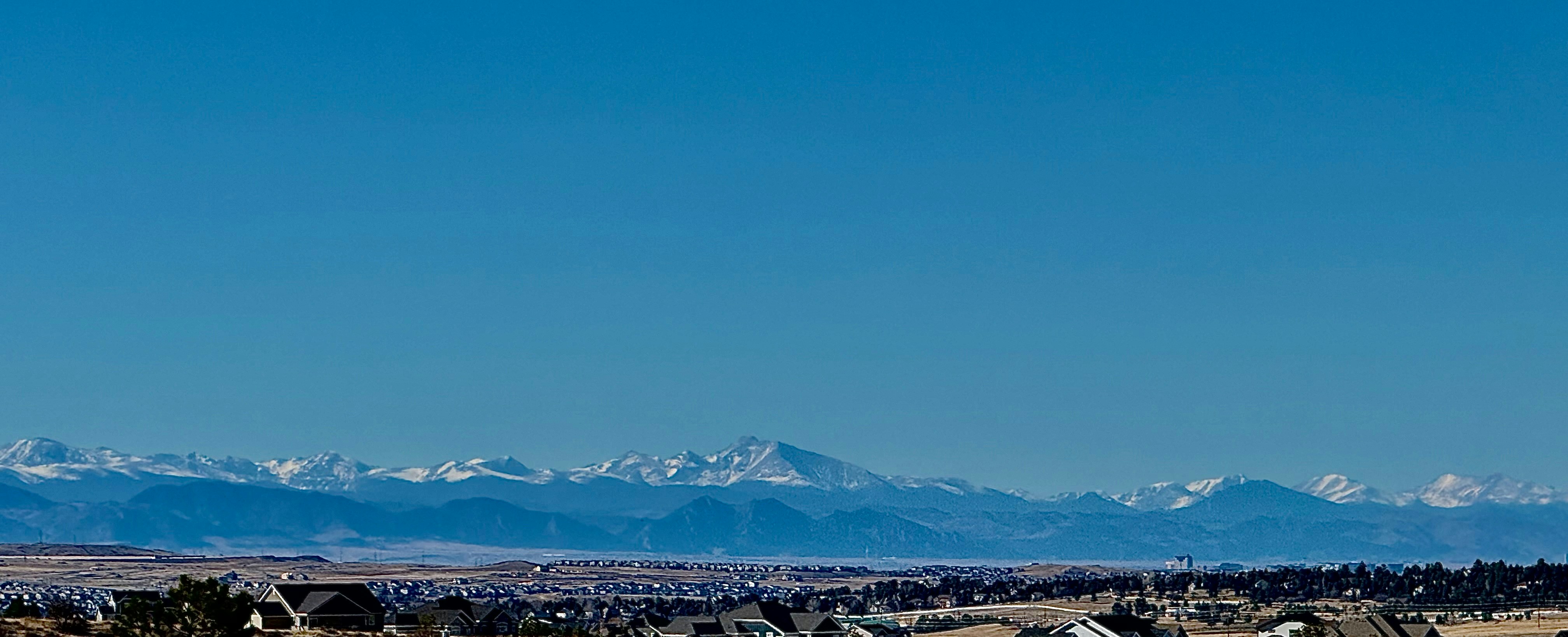 Snow-dusted Peaks Over a Quiet Desert Dawn