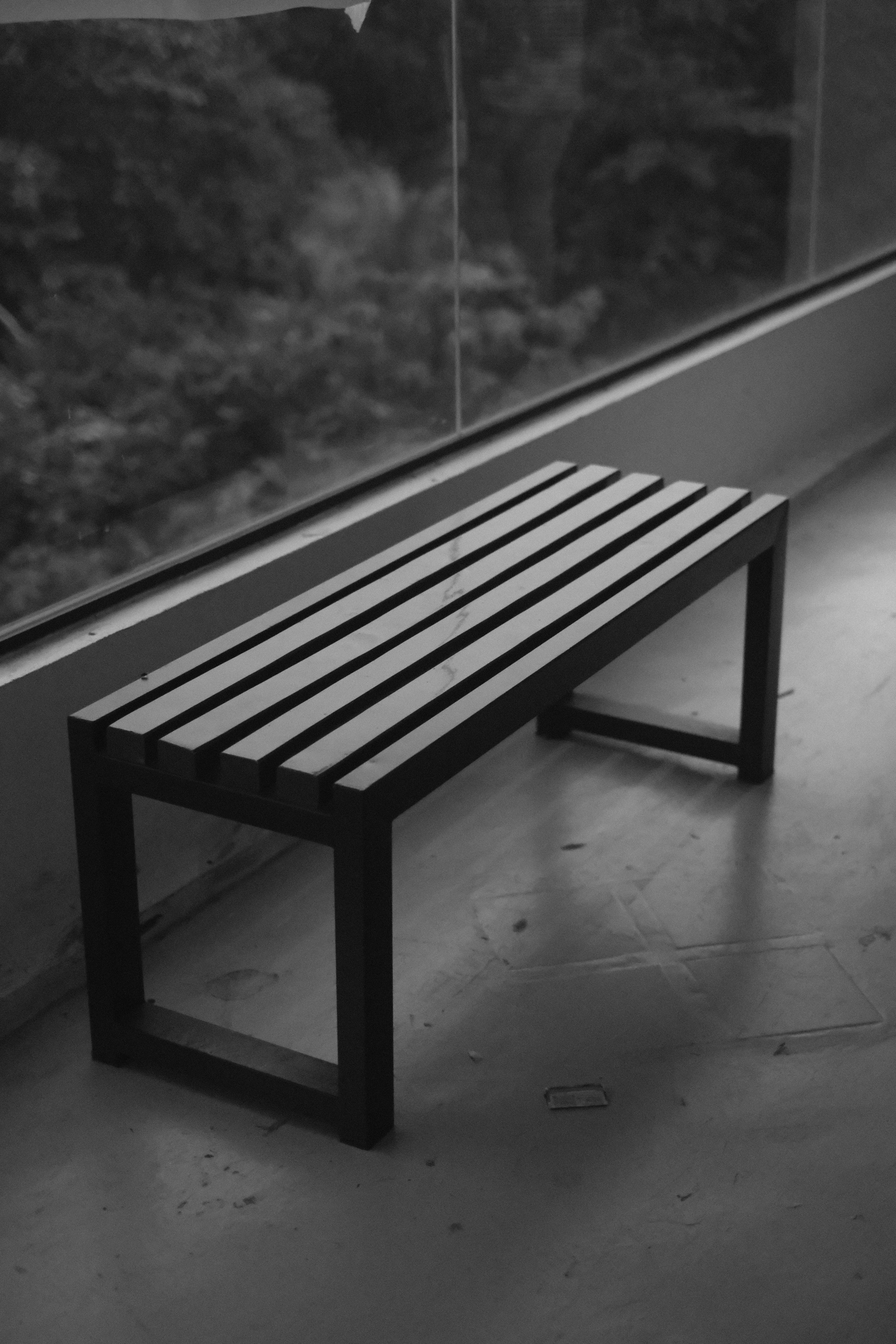 Empty Slats: A Quiet Bench by the Window