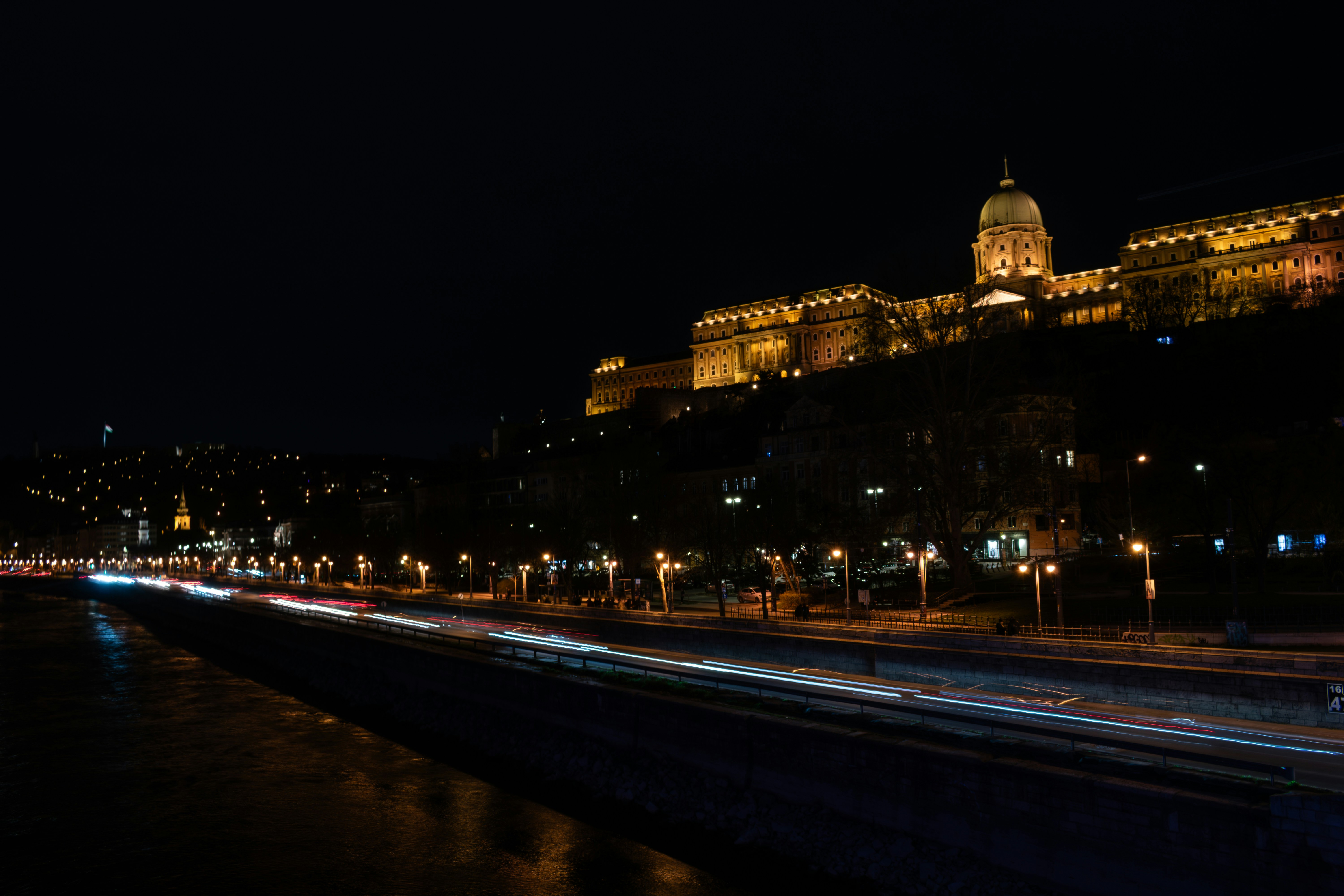Illuminated Citadel Overlook: Night traffic Trails along the Danube