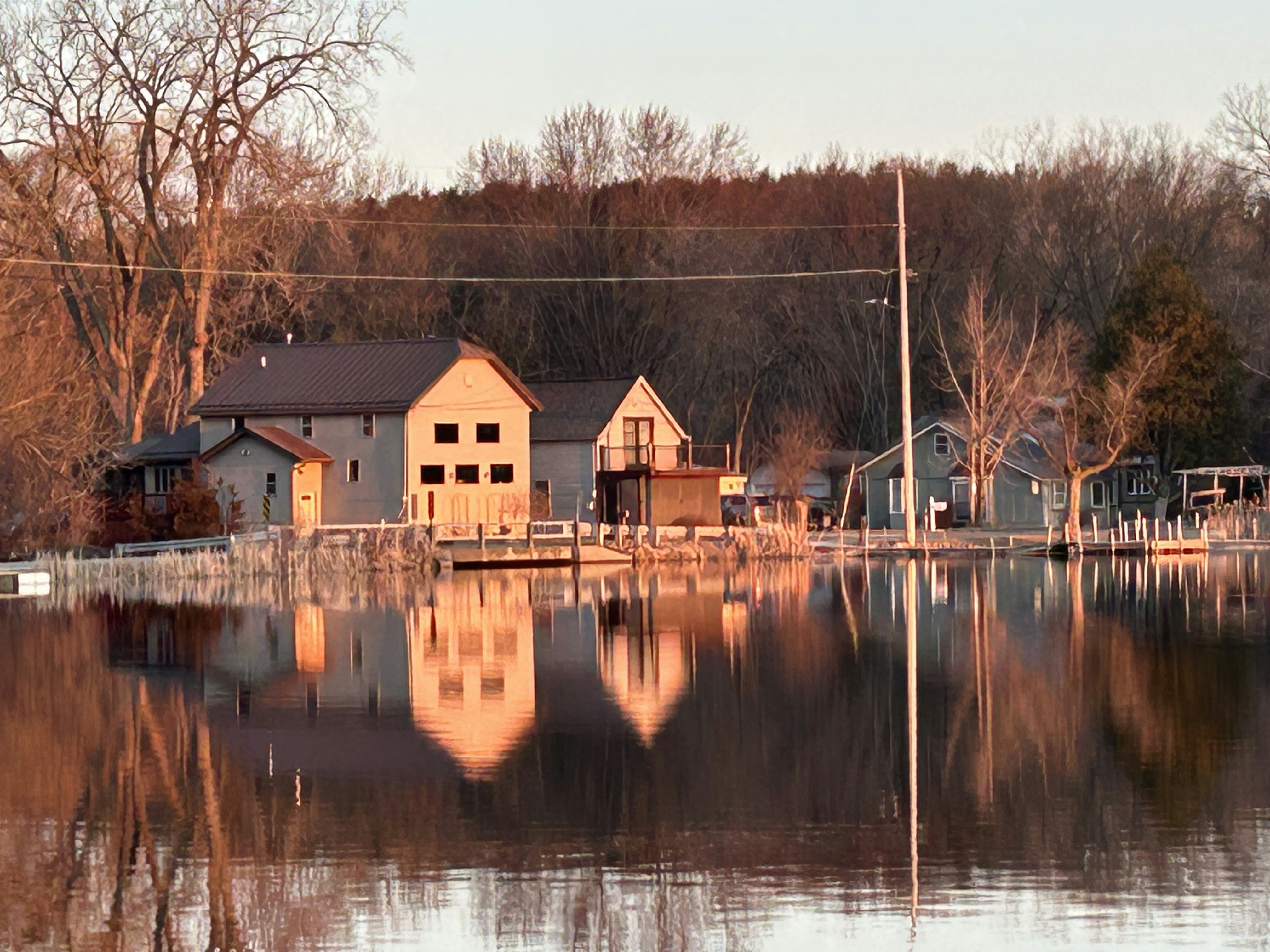 Sunset Reflections on a Quiet Lakeside Row