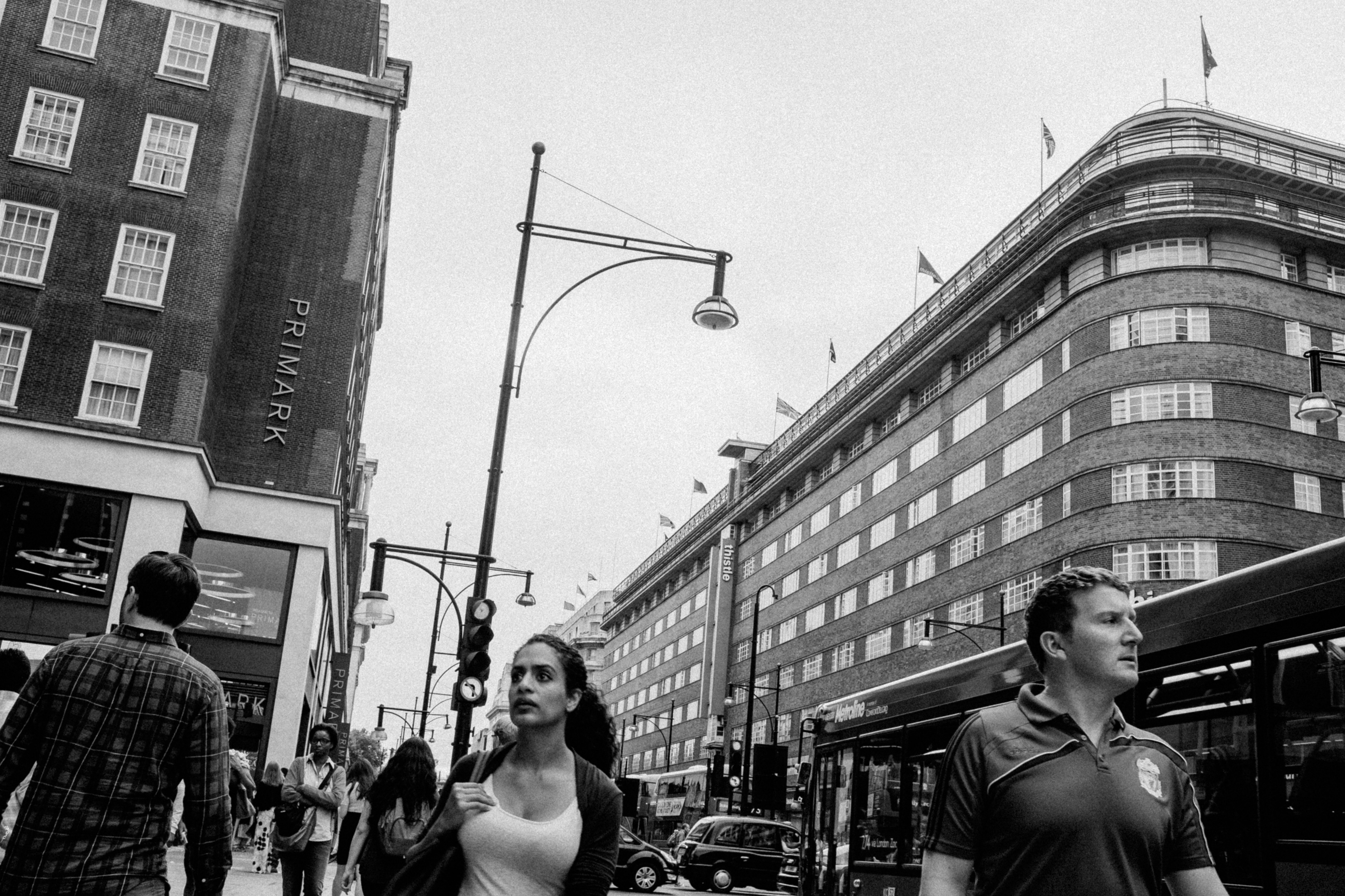 Midday Crossing: City Pedestrians Nave the Arching Street