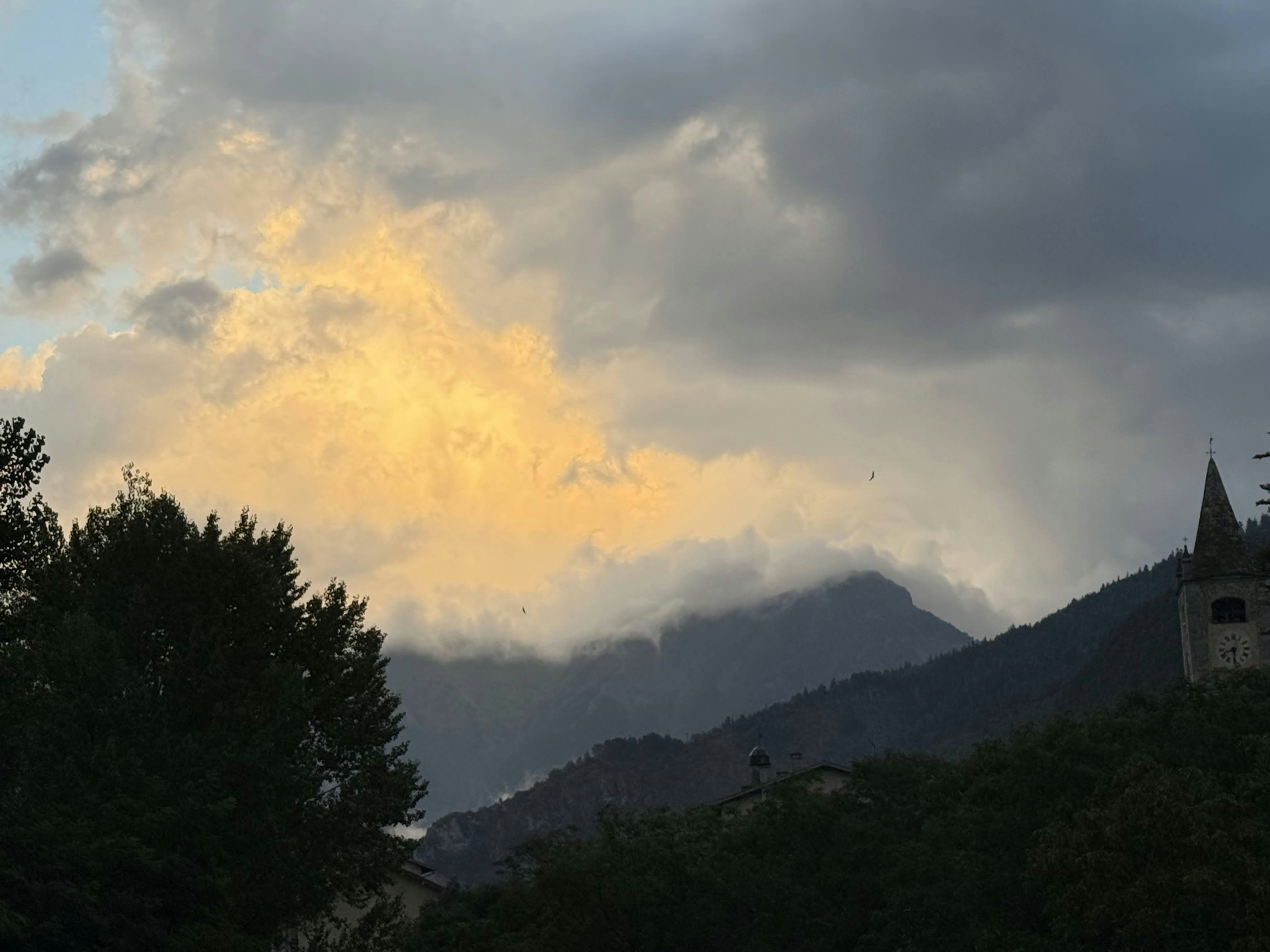 Golden Cloud Break Over Alpine Ridge