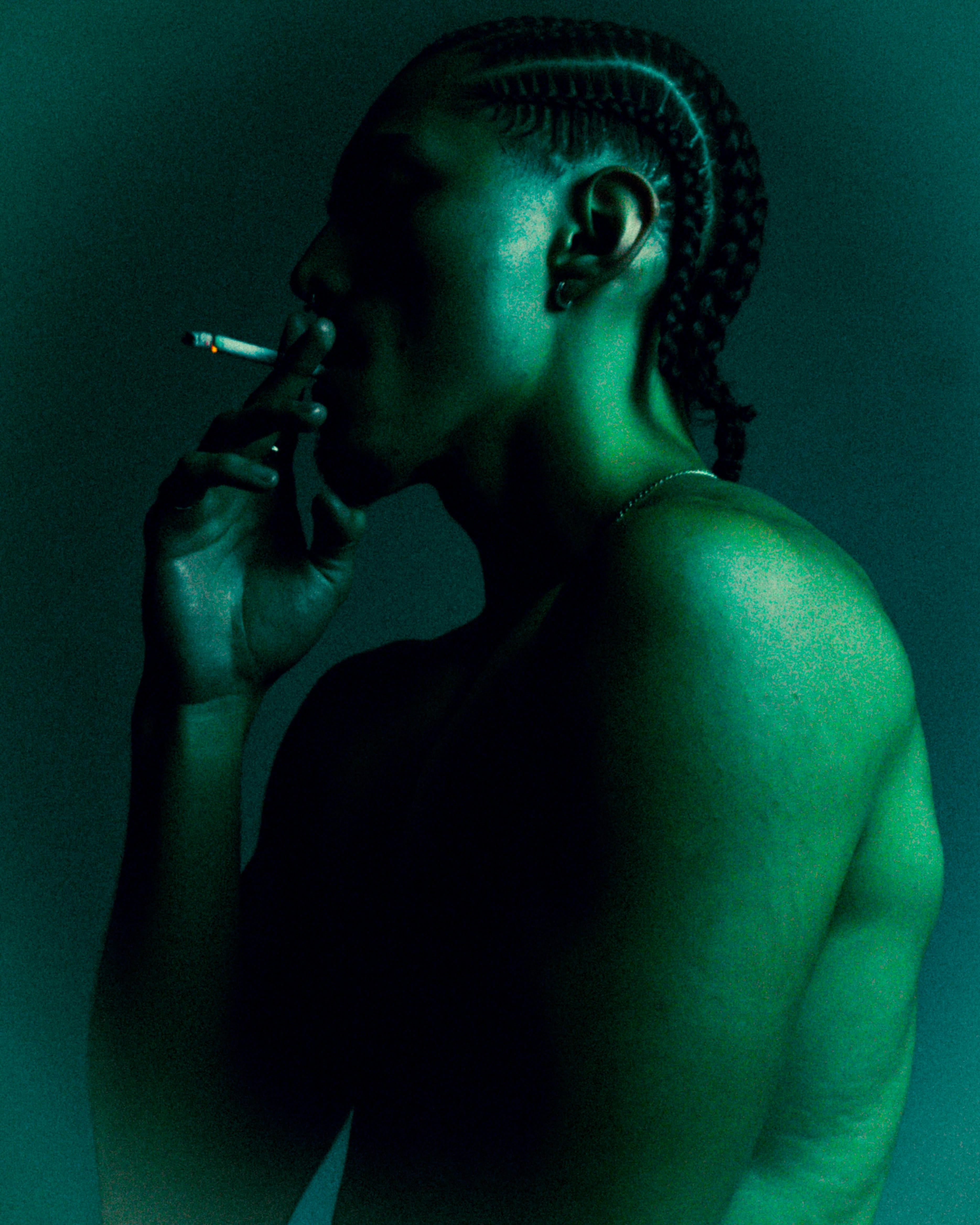 Midnight Smoke: A Portrait in Green Bathed by Neon Shadows