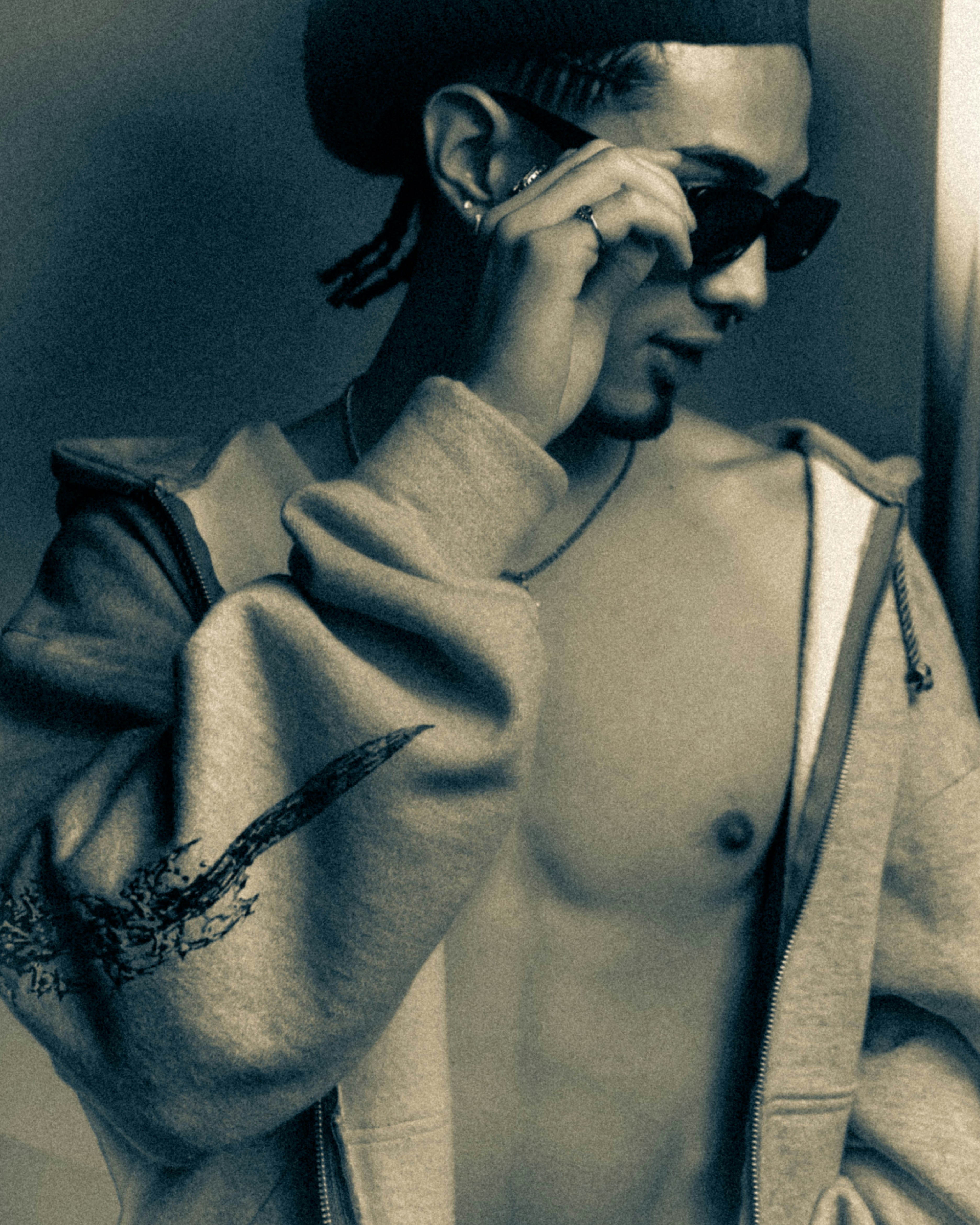 Monochrome Confidence: Sunglasses and Soft Shadow of a Hoodie Moment