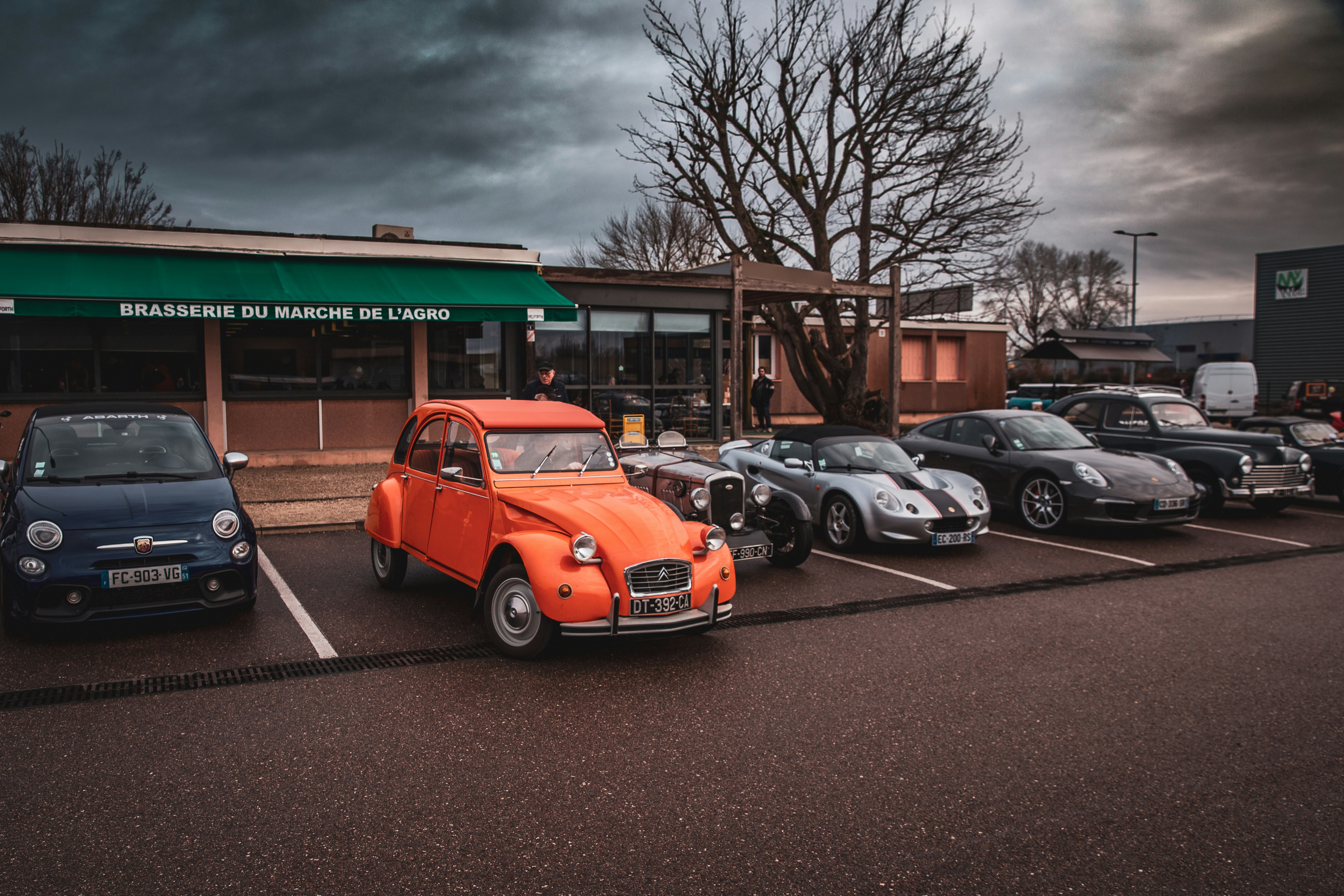 The Orange Classic: A Retro Car Row in the Parking Lot