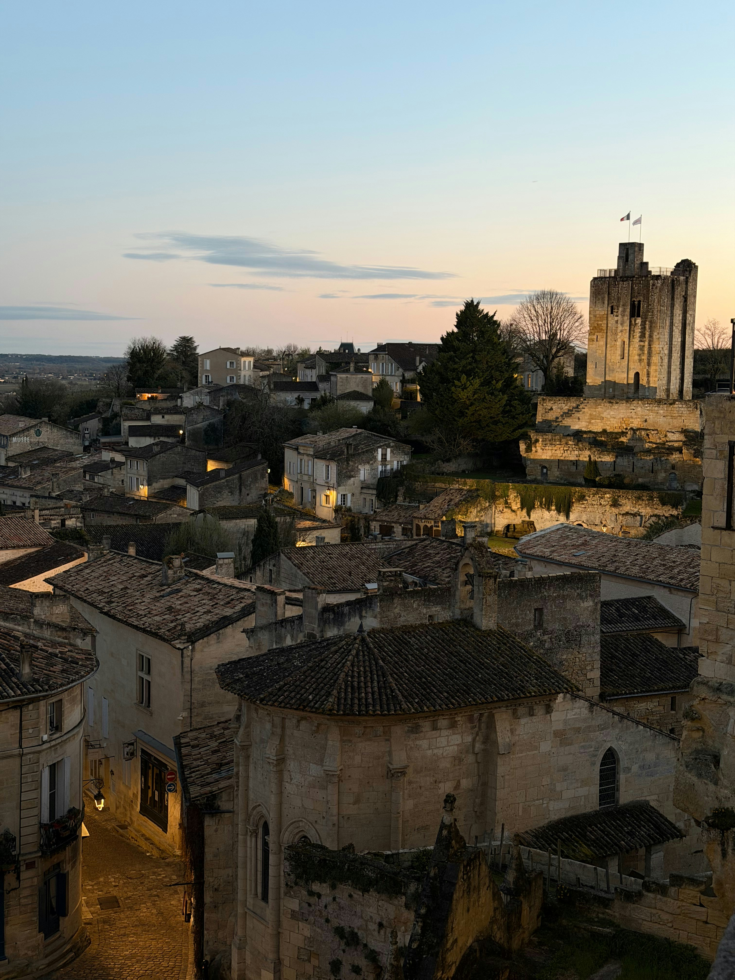 Sunlit Bastion Overlook: A Medieval Village at Dusk