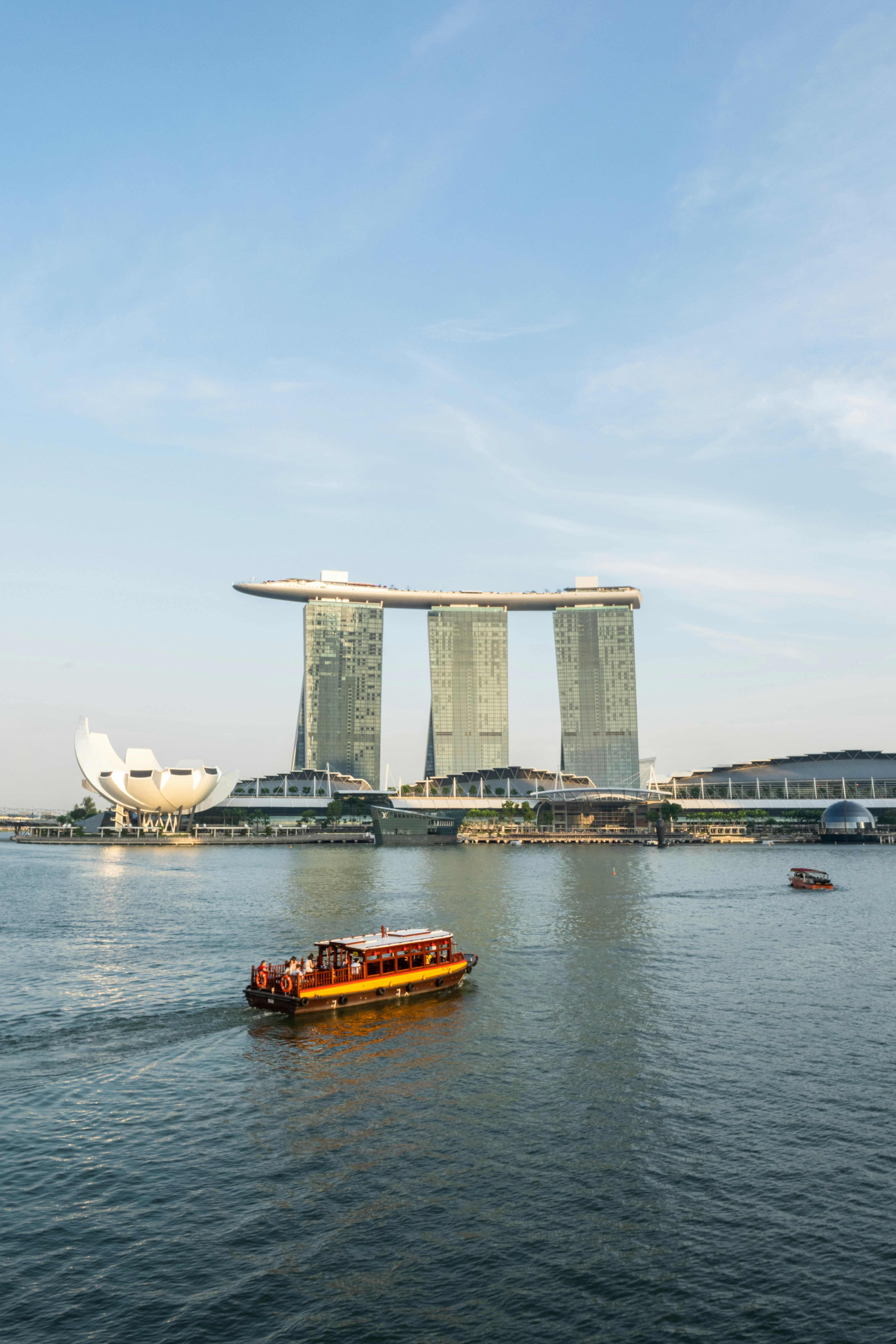 Marina Bay Silhouette: A Boat Traverses Calm Singapore Waters
