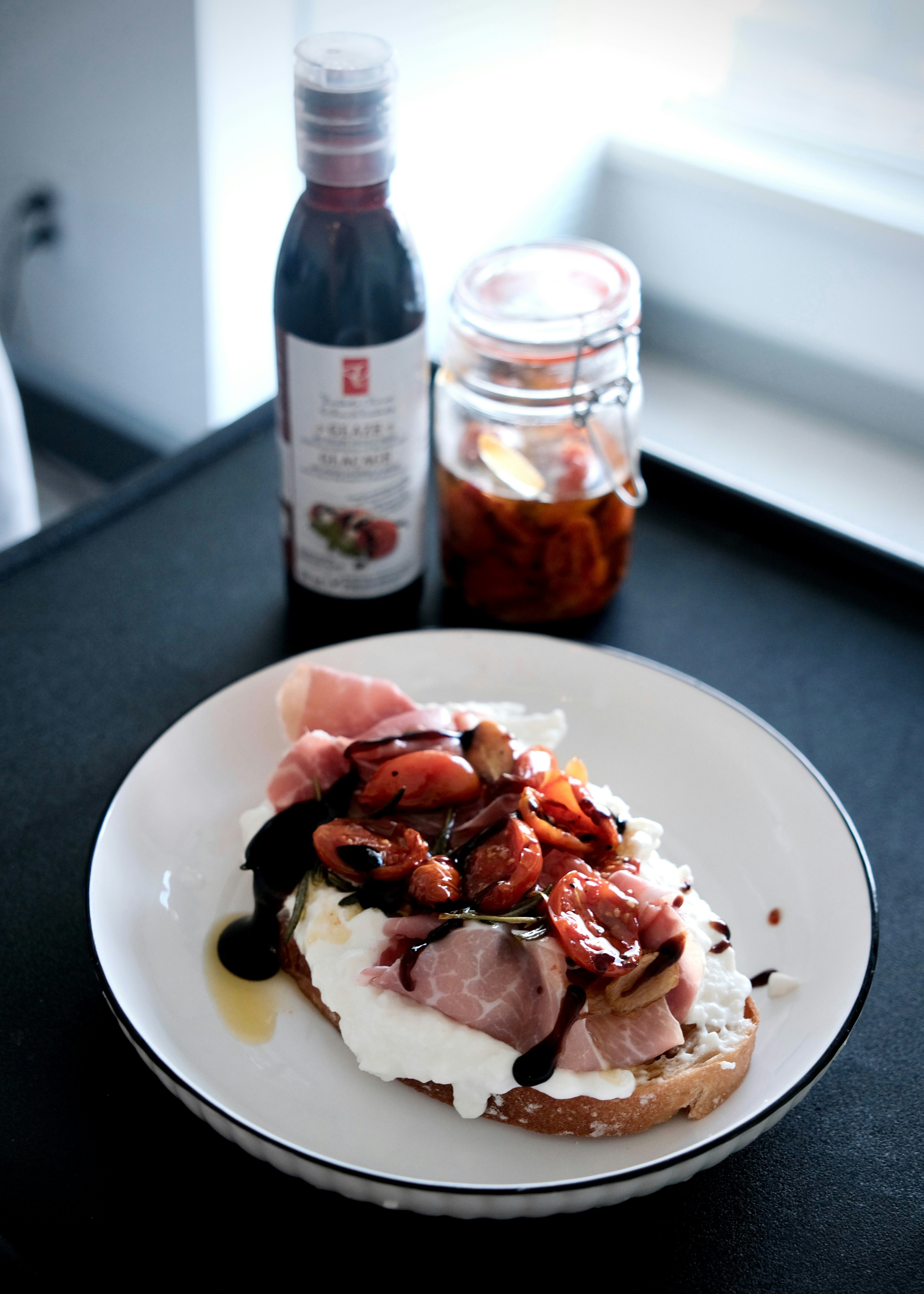 Open-Faced Charcuterie: A Cozy Meal on a Black Counter
