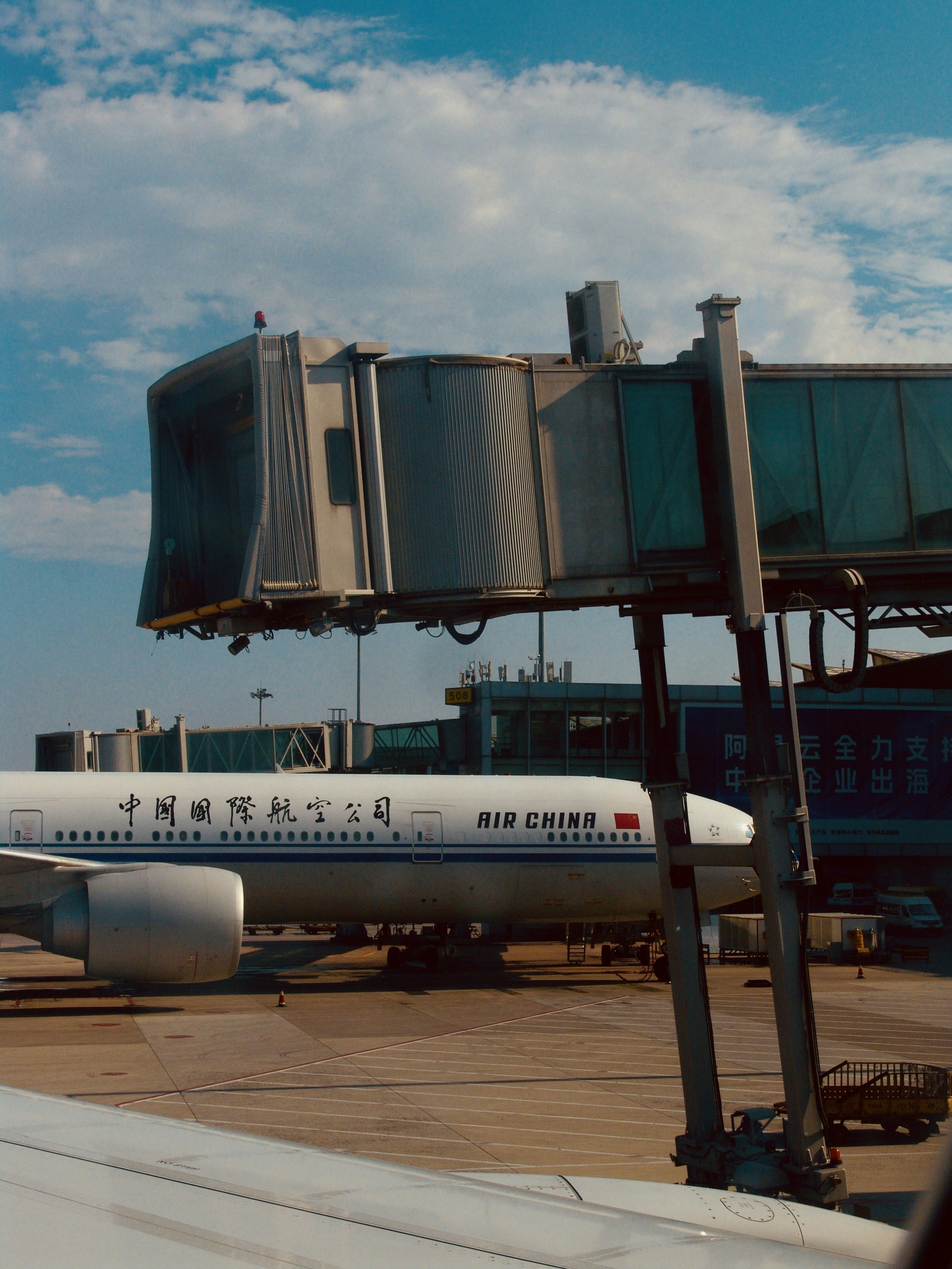 Jetway Shadows and a Silent Giant: Air China at Gate 1