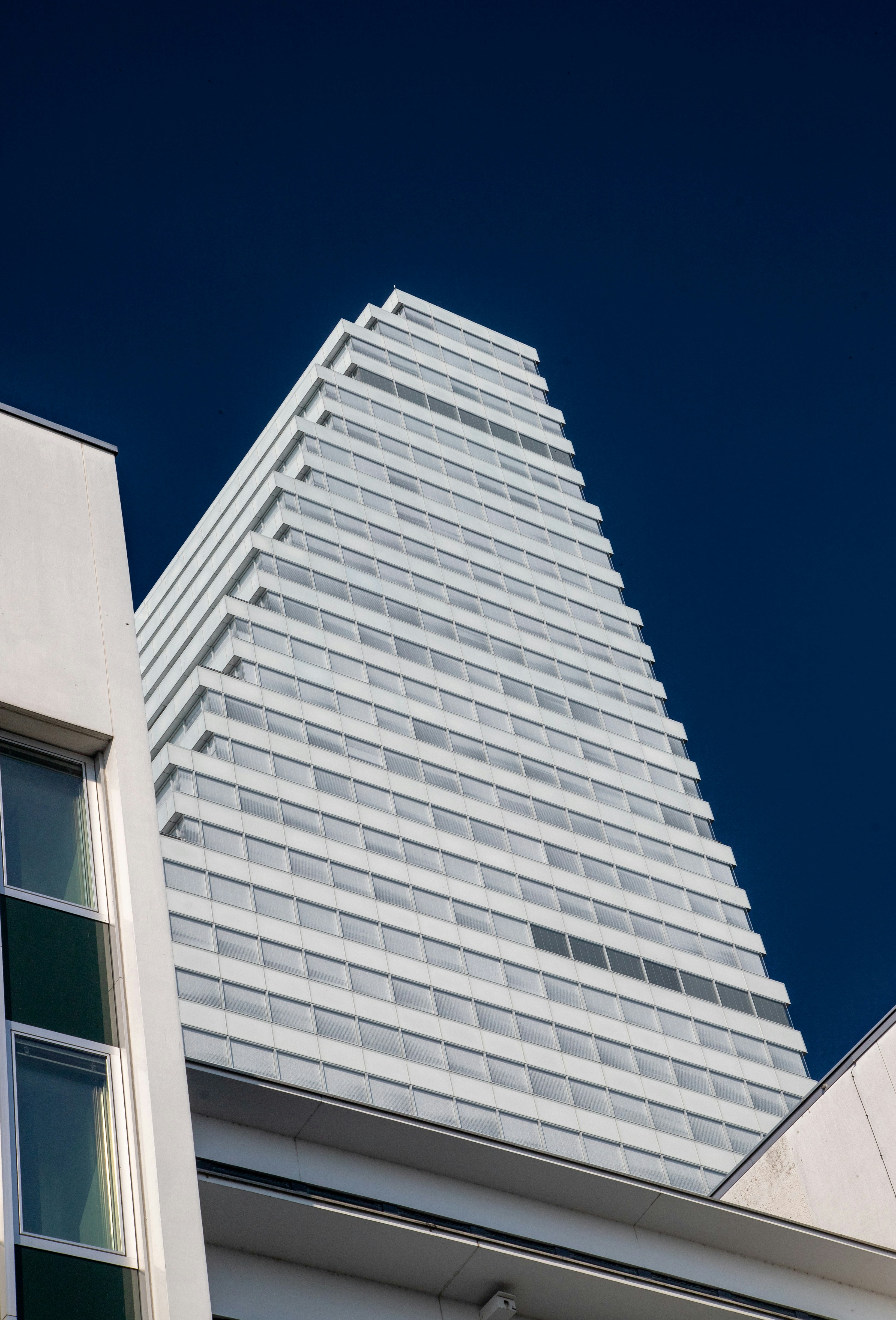Staircase Sky: A Skyward Modern Tower Piercing the Deep Blue