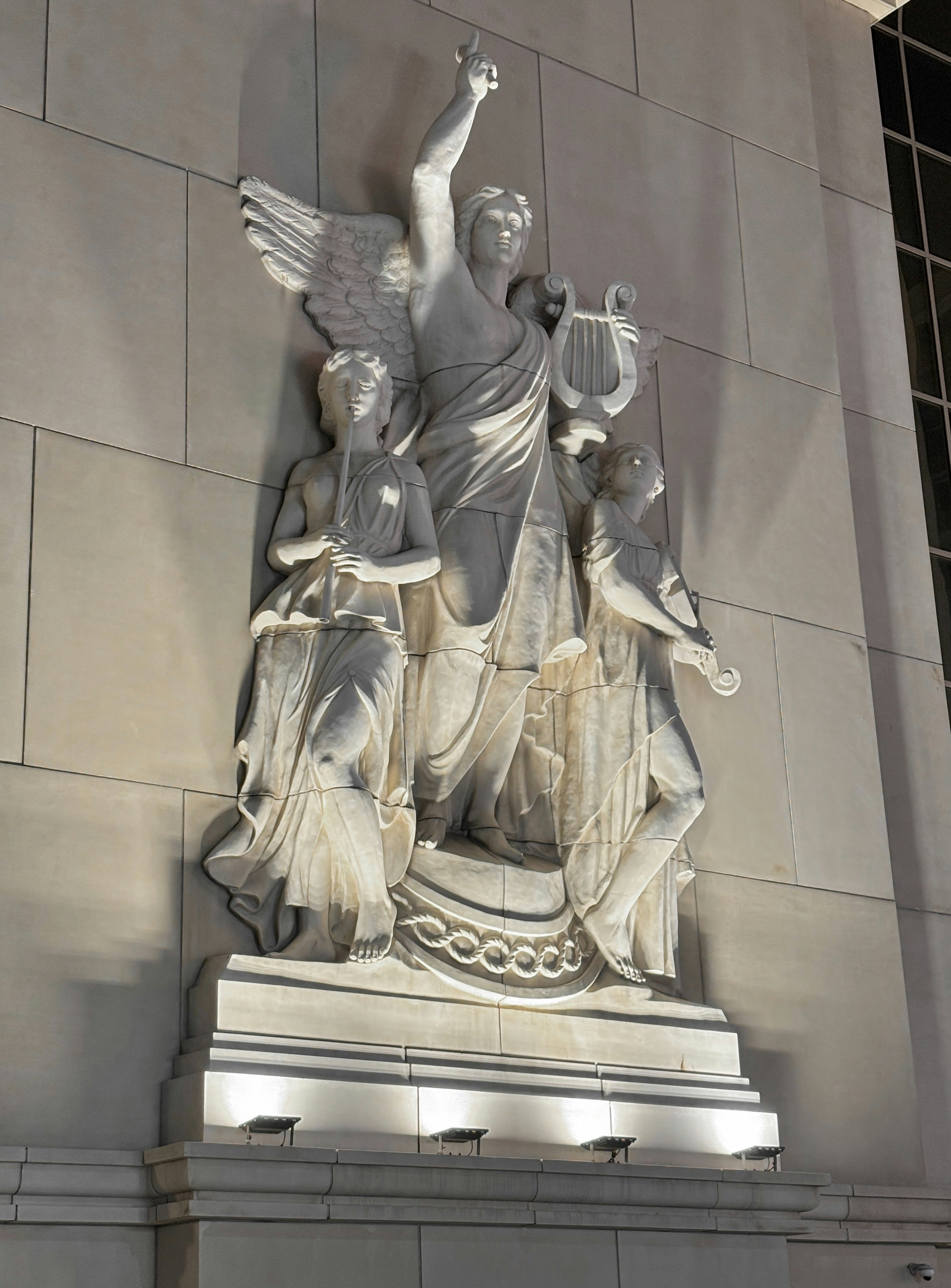 Winged Wall Sculptures Reaching Toward Light