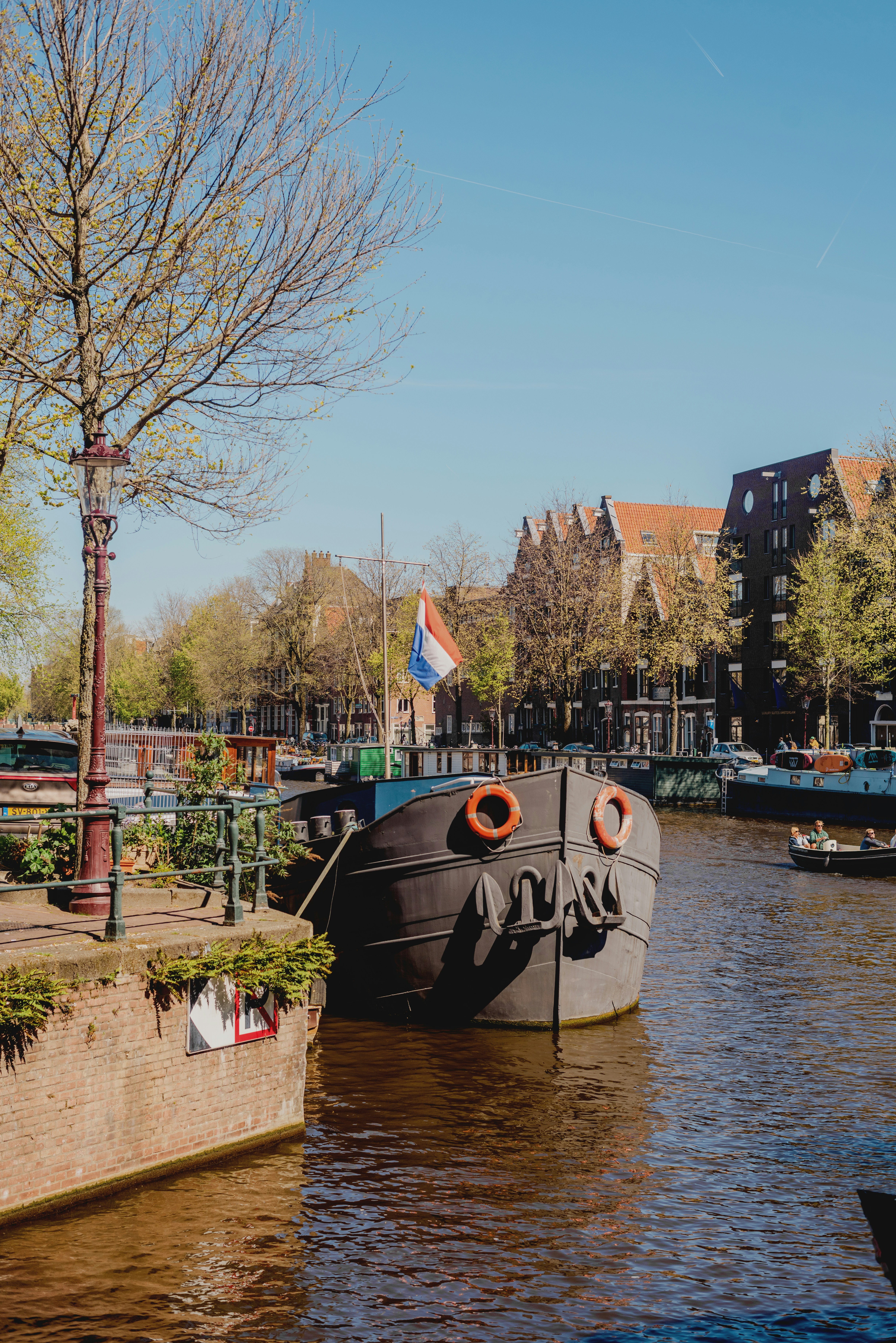 Towpath at Dusk: A Boat Mooring along a Dutch Canal