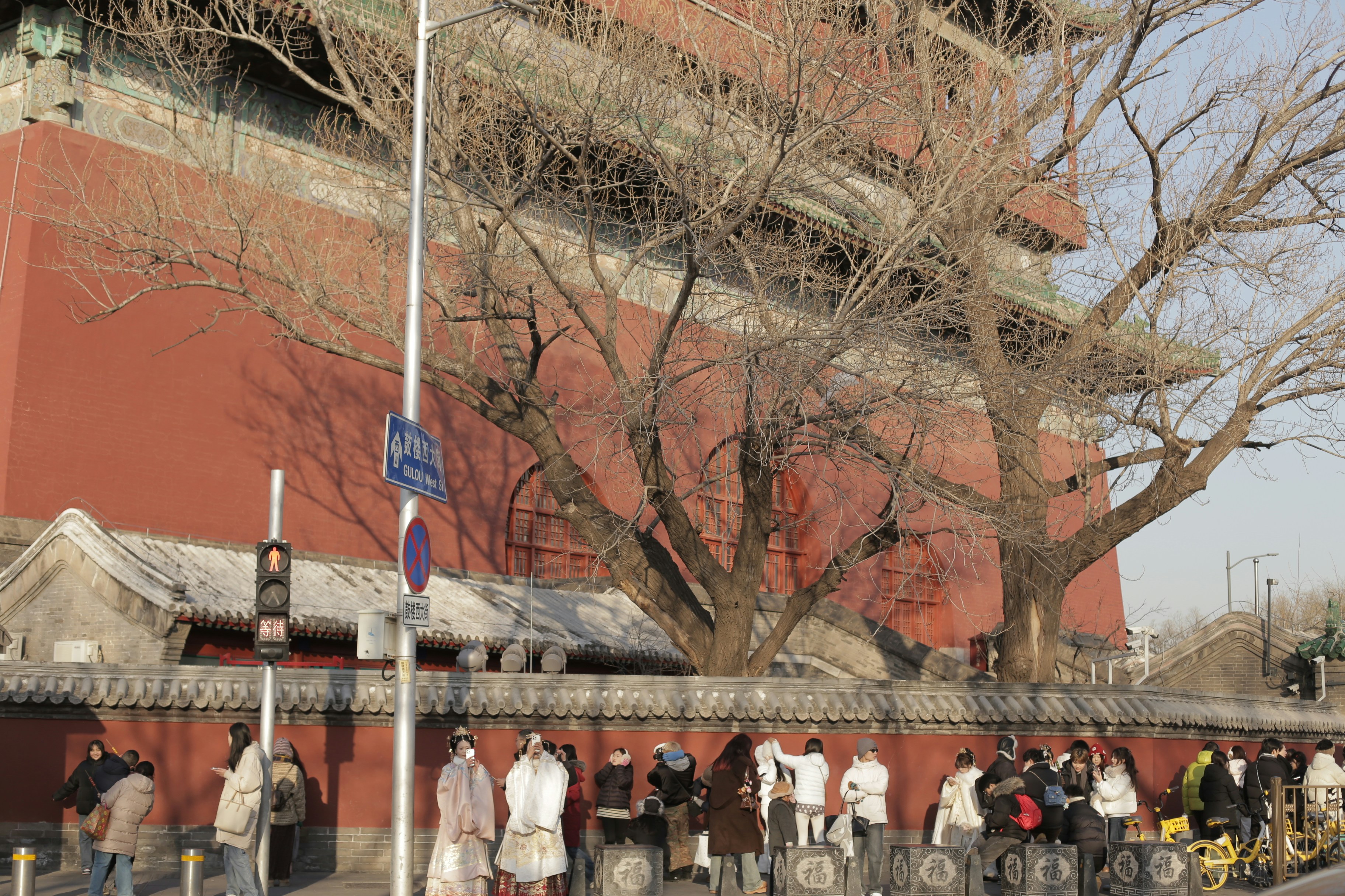 Red Wall, White Gatherers: A Quiet Line Snaking by the Temple