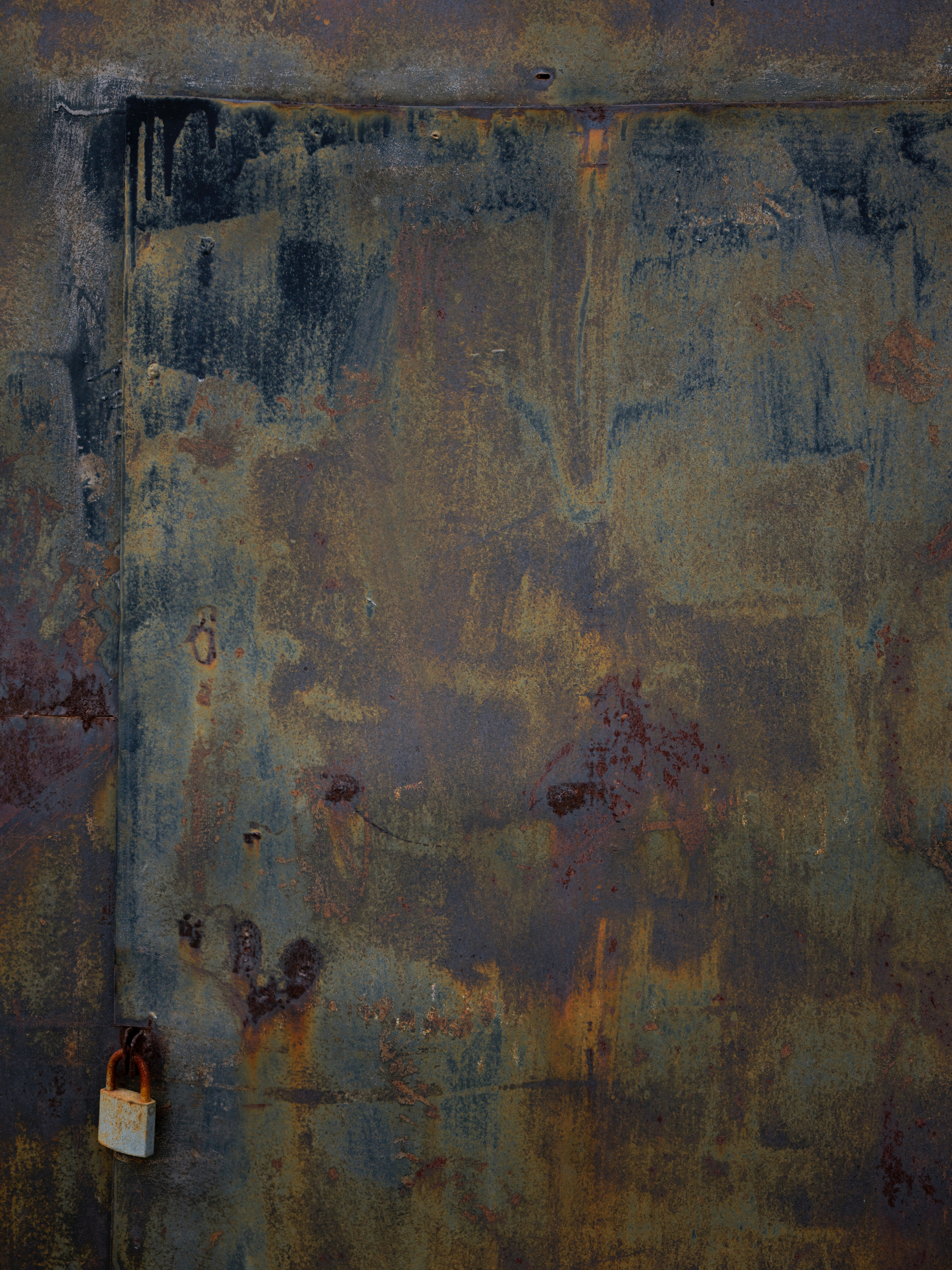 Lock on a Rusted Door: Patina and Padlock in Dusk