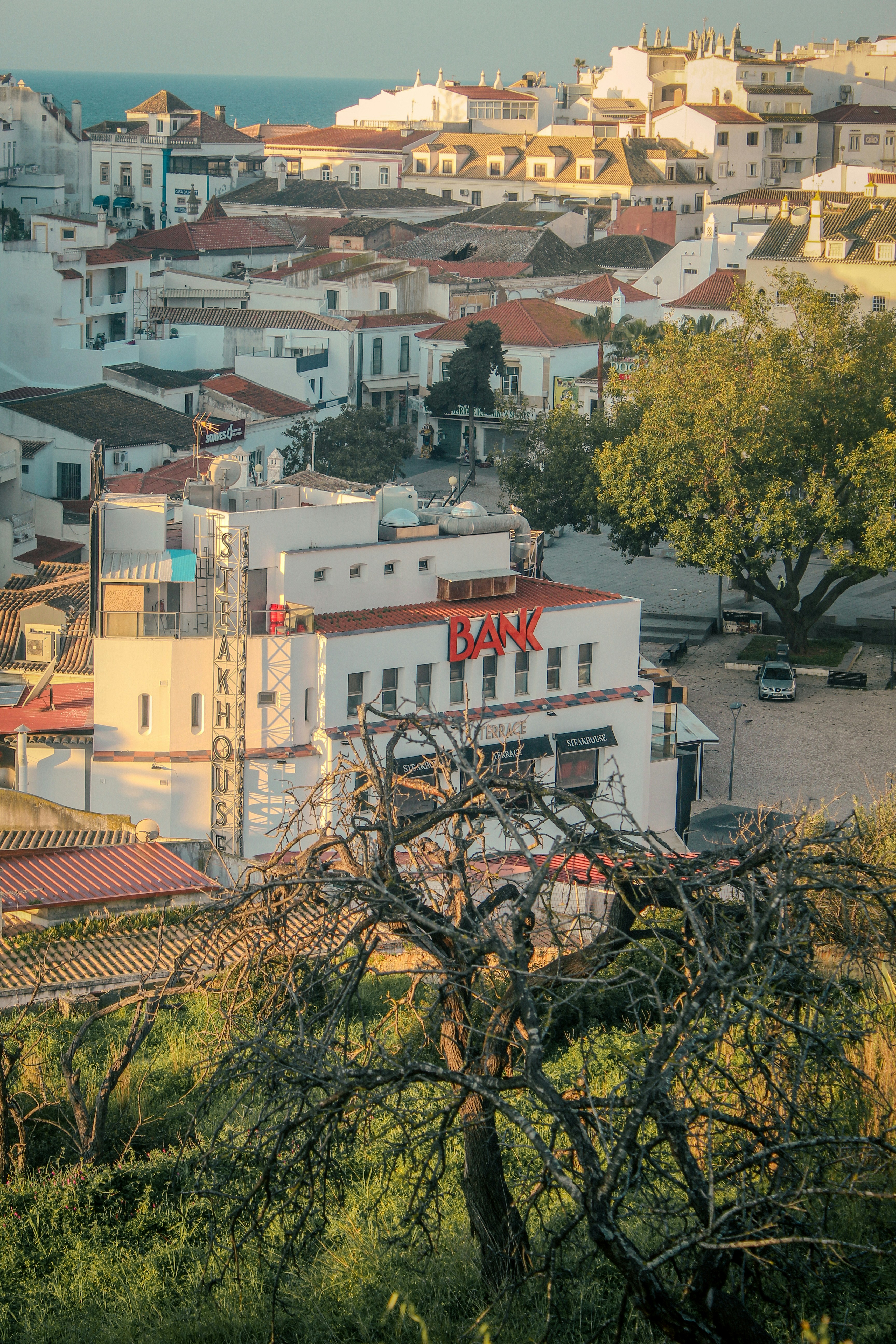Sunlit Banks of a Quiet Coastal Town