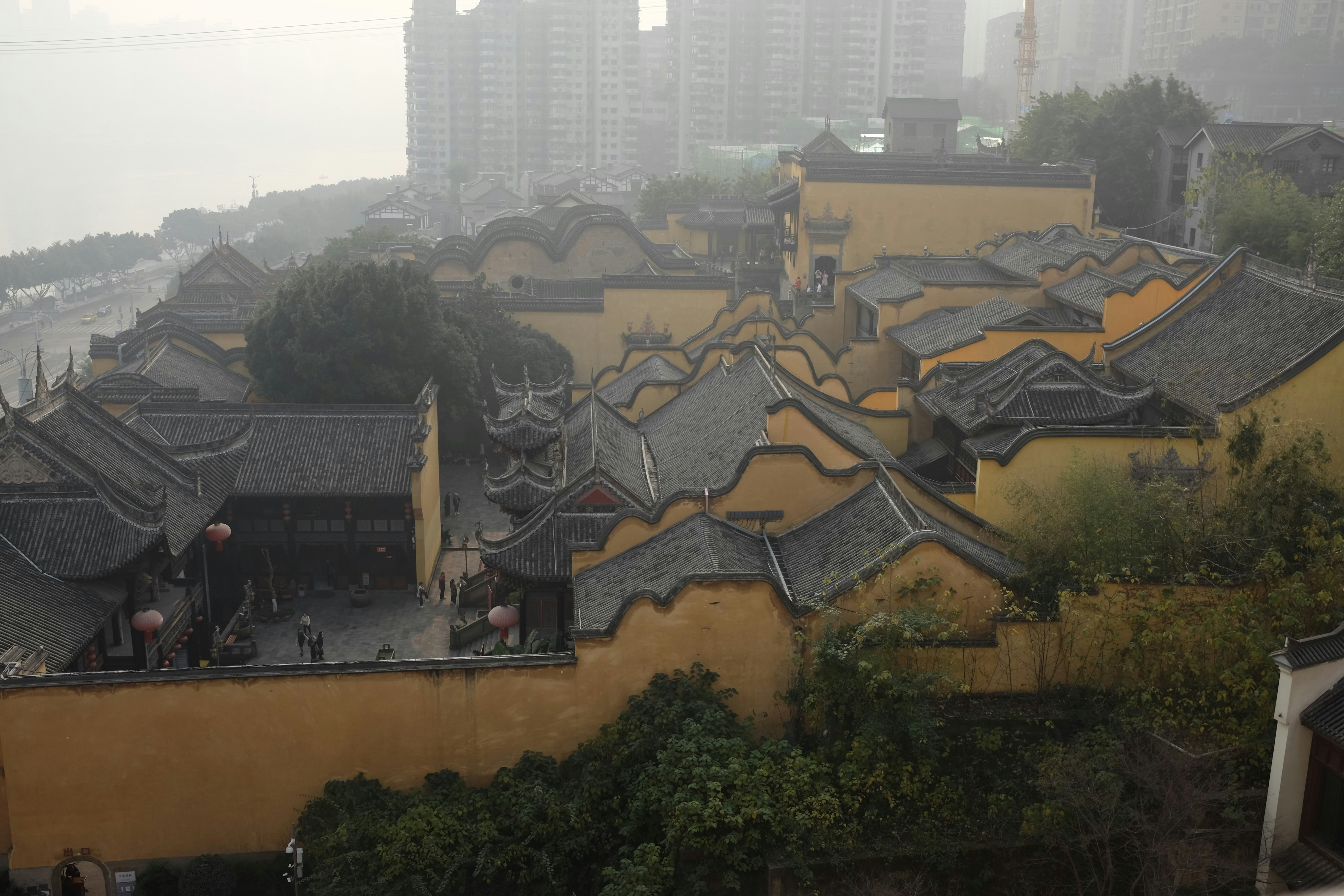 Amber Walls and Tiled Rooftops: A Quiet Old Quarter Under Mist