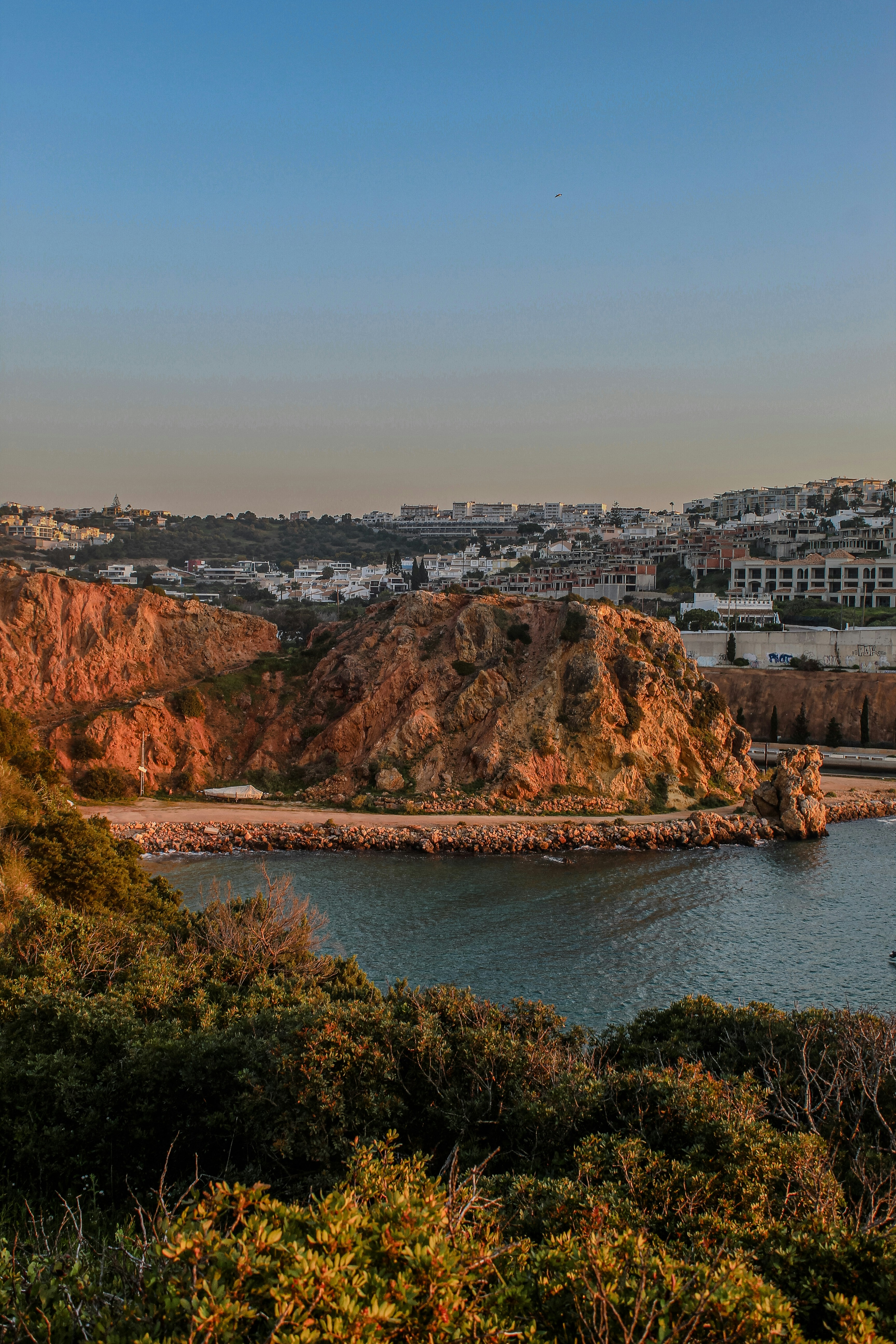 Coastal Cliffs at Golden Hour Reveal a Quiet Town