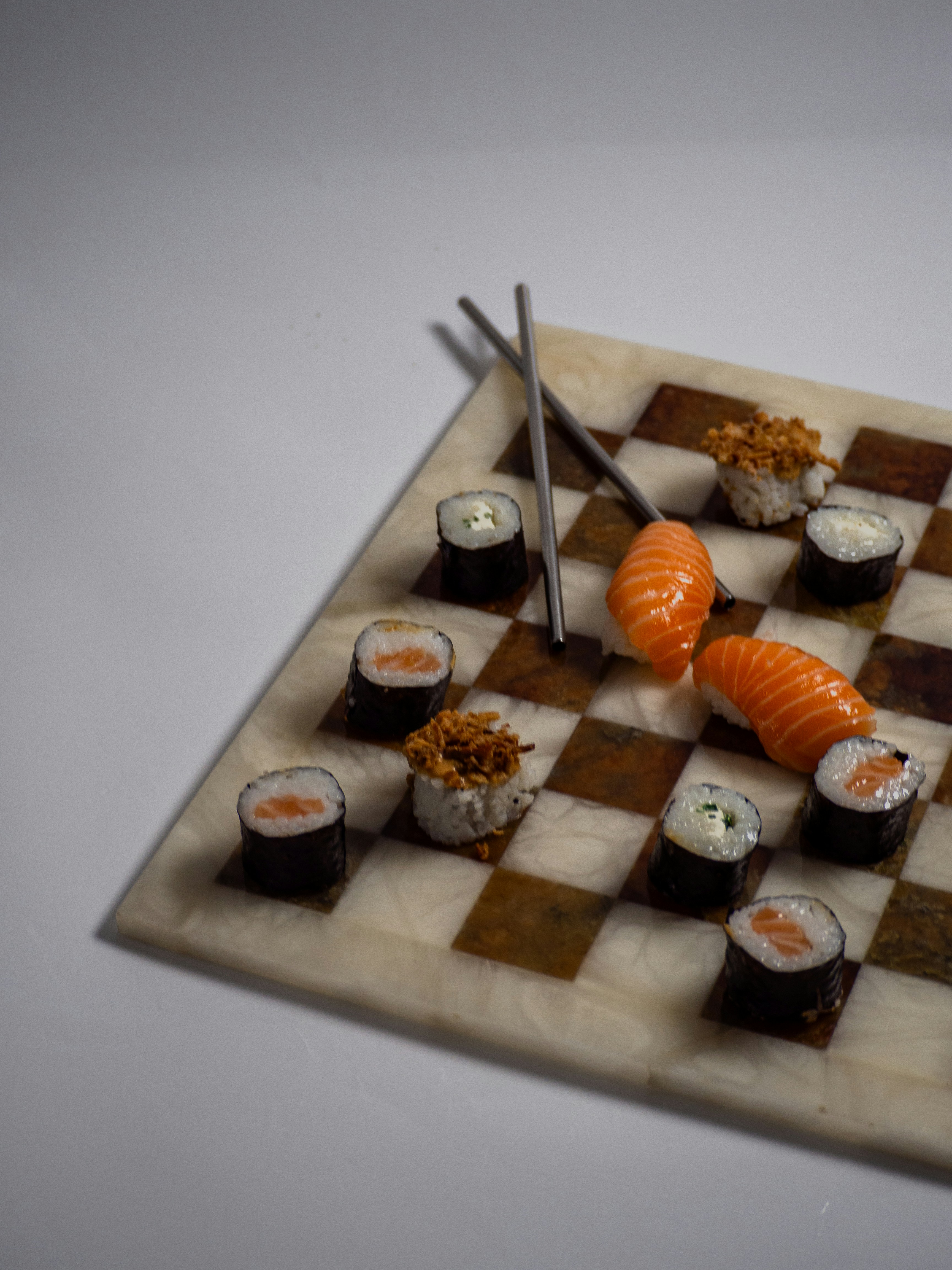 Sushi on a Tilt: A Chessboard of Nigiri