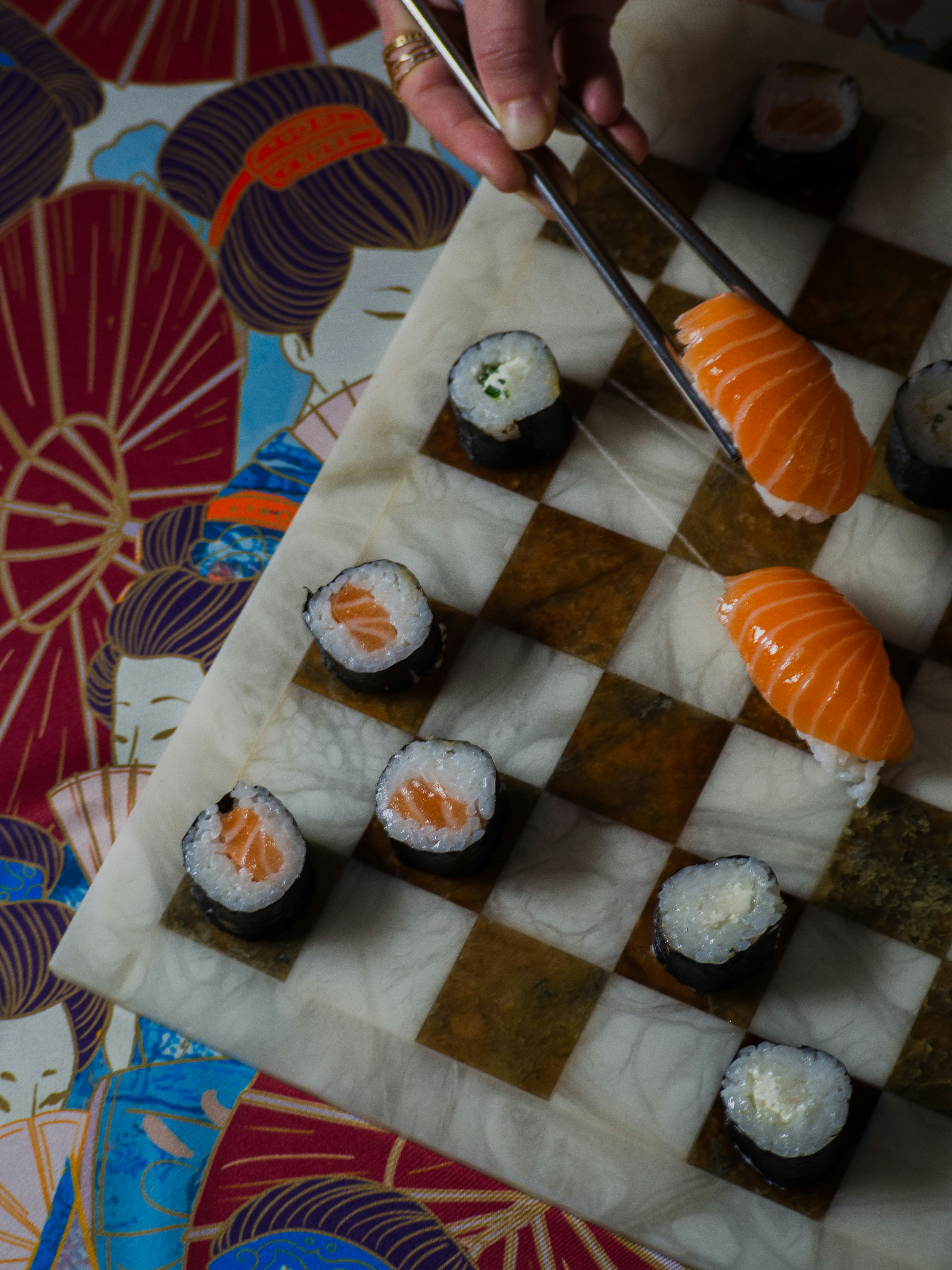 Chopsticks Lift: Salmon Nigiri Over a Marble Chessboard