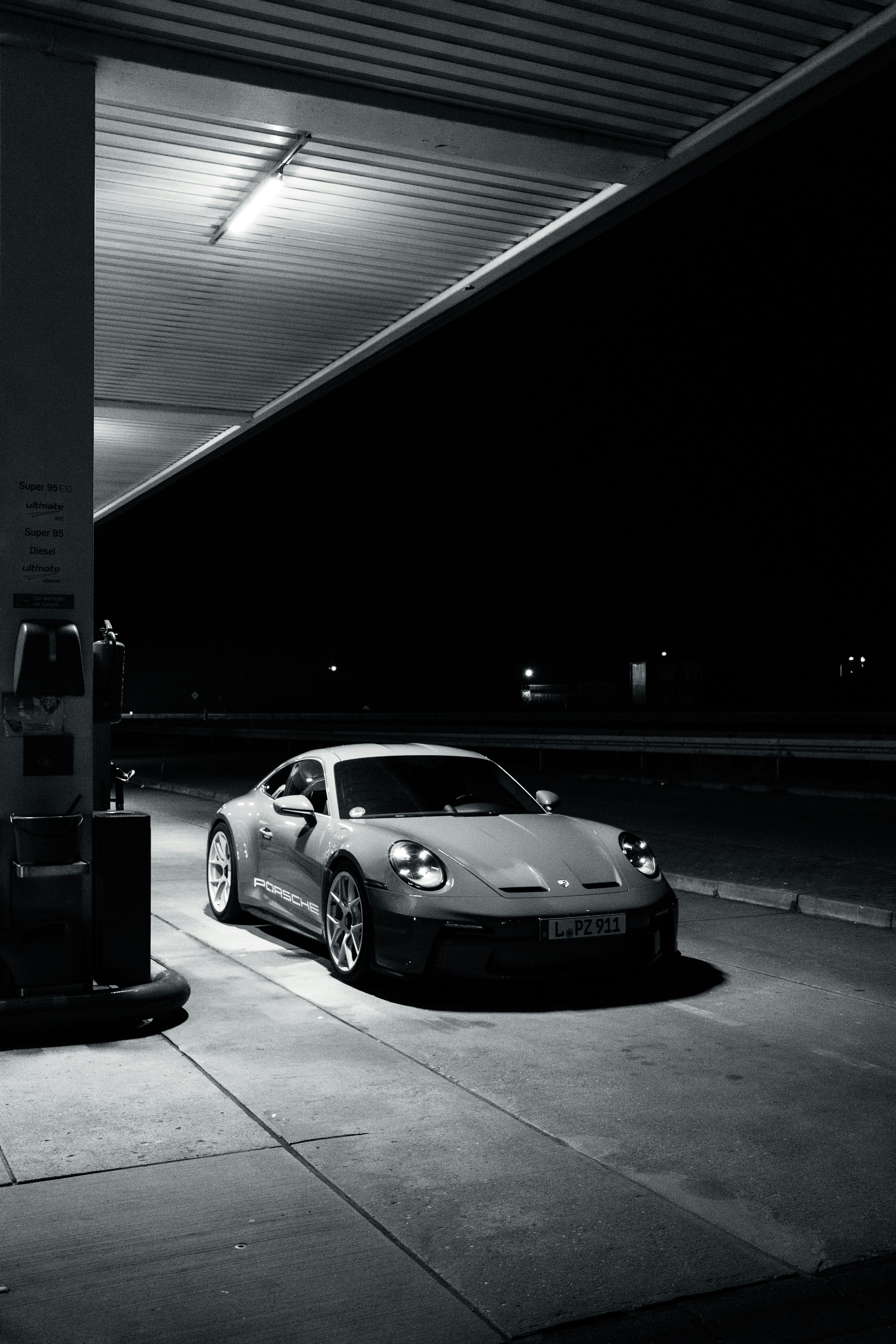 Midnight Porsche at the Pump: A Quiet Portrait in the Petrol Lights