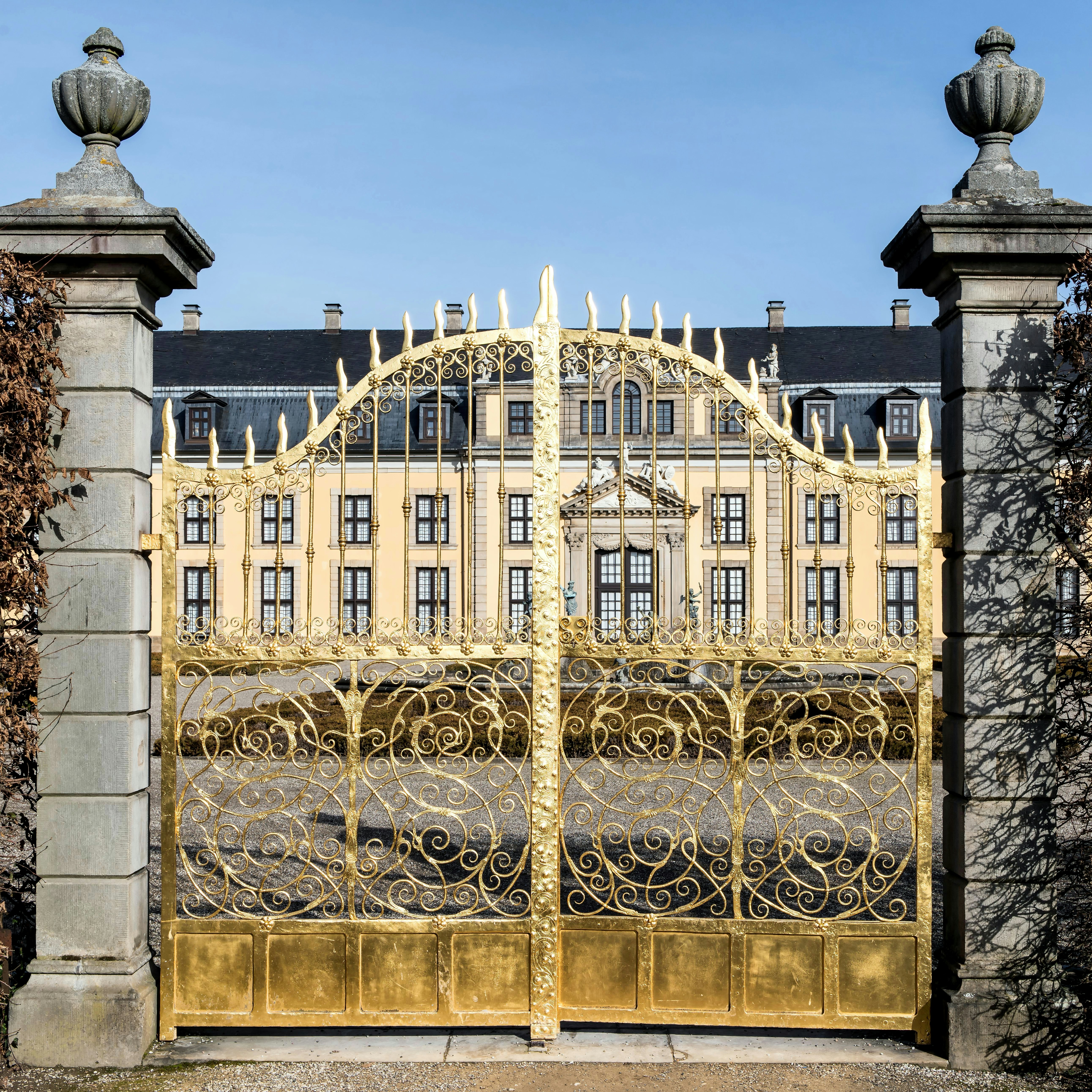 Golden Gate to a Baroque Facade: Alicia in Spring Courtyard