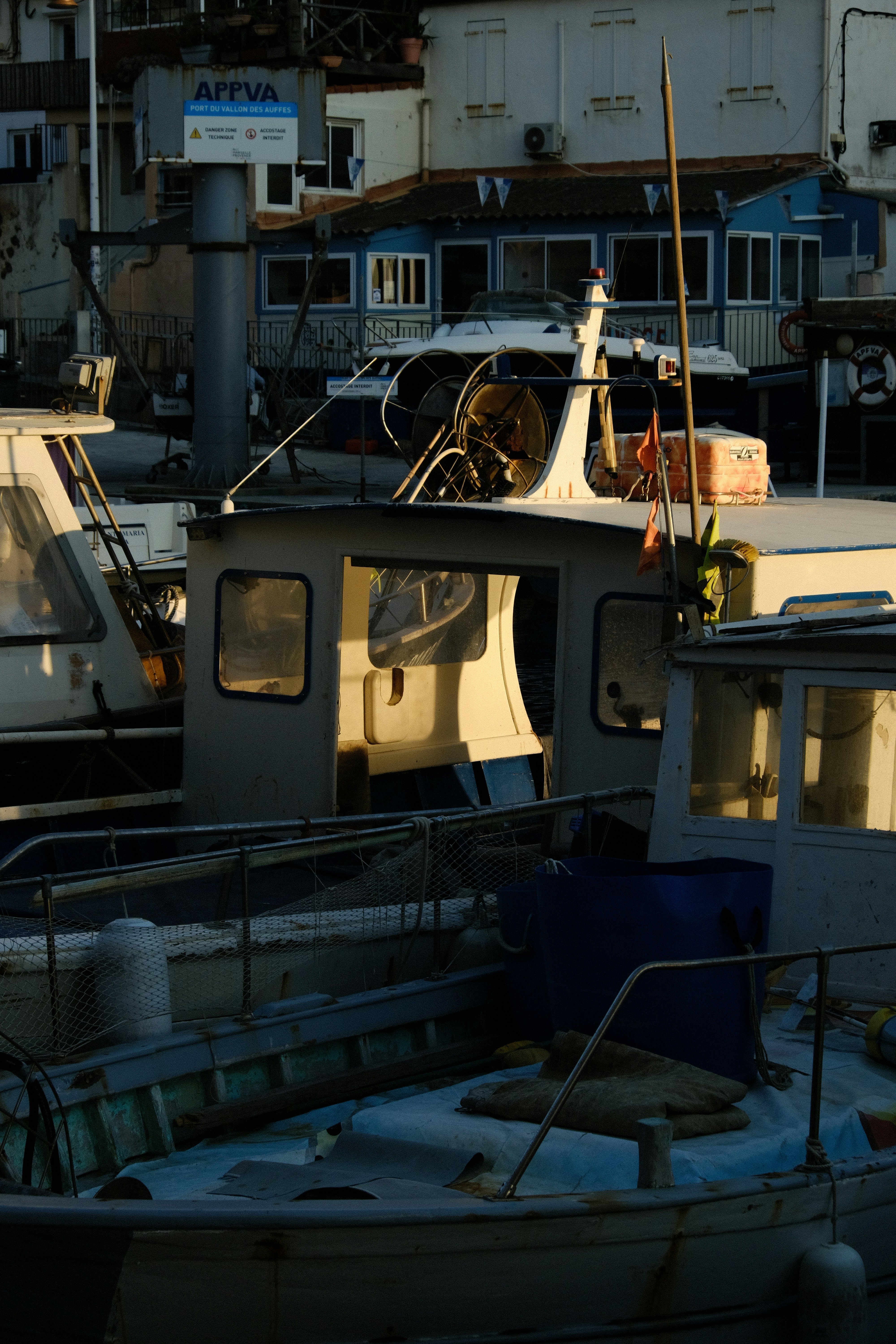 Harbor Whimsy: Boats and Backlit Cabins in Dusk