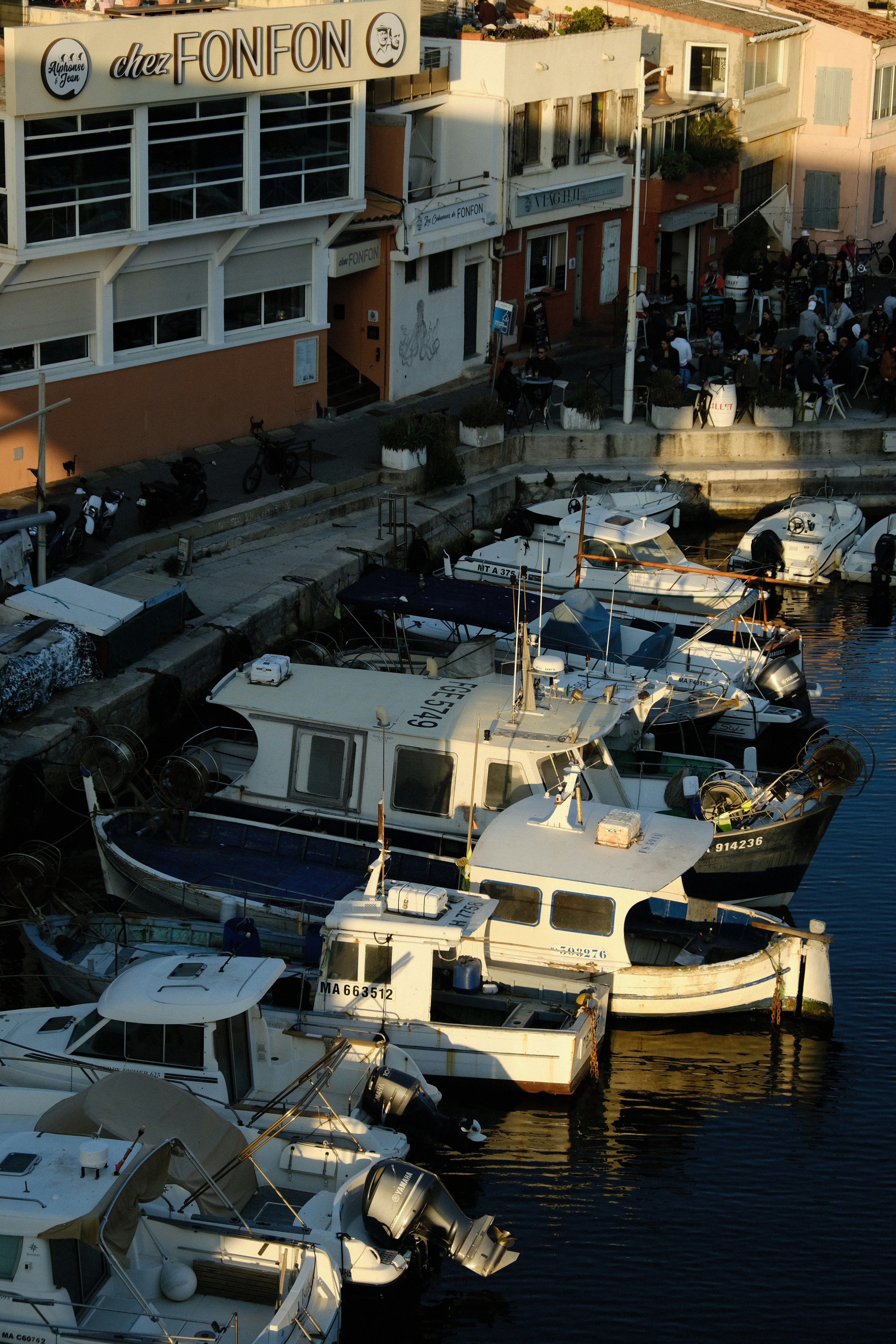 Harbor Veil: Boats at Dusk by a Terraced Café