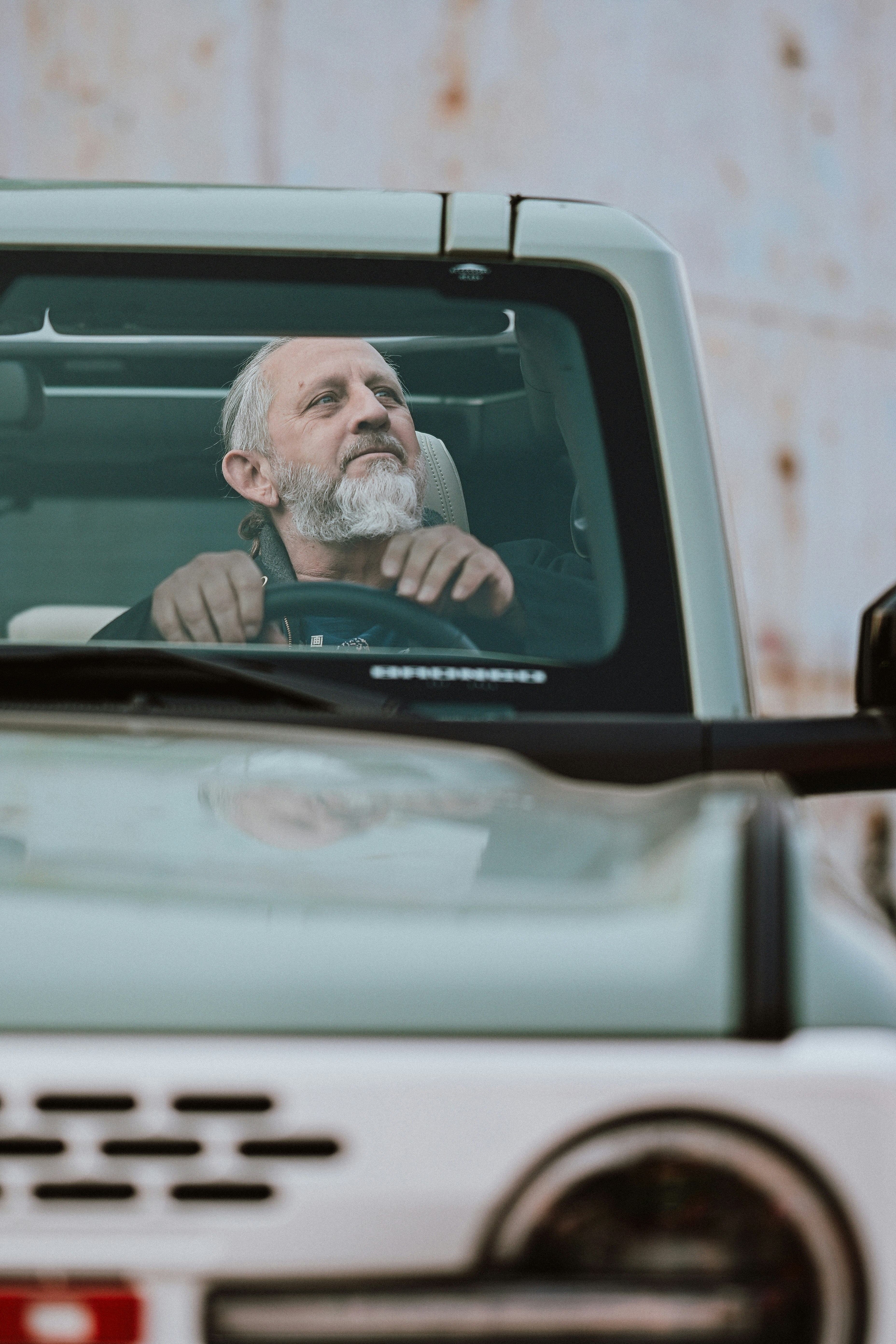 Steering Wisdom: An Older Gentleman at the Wheel}