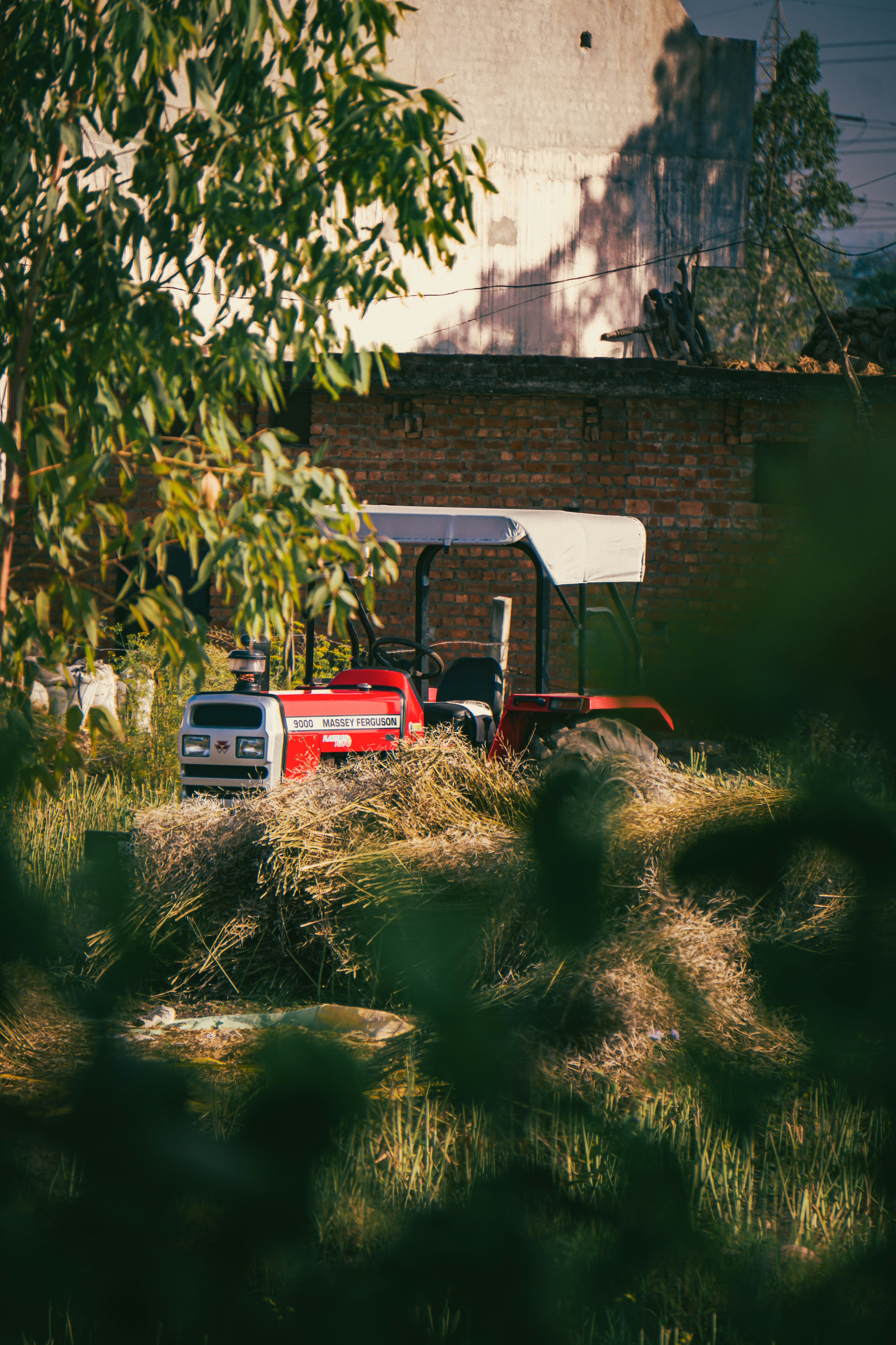  Tractor Row: Red Machines Resting in a rural Yard