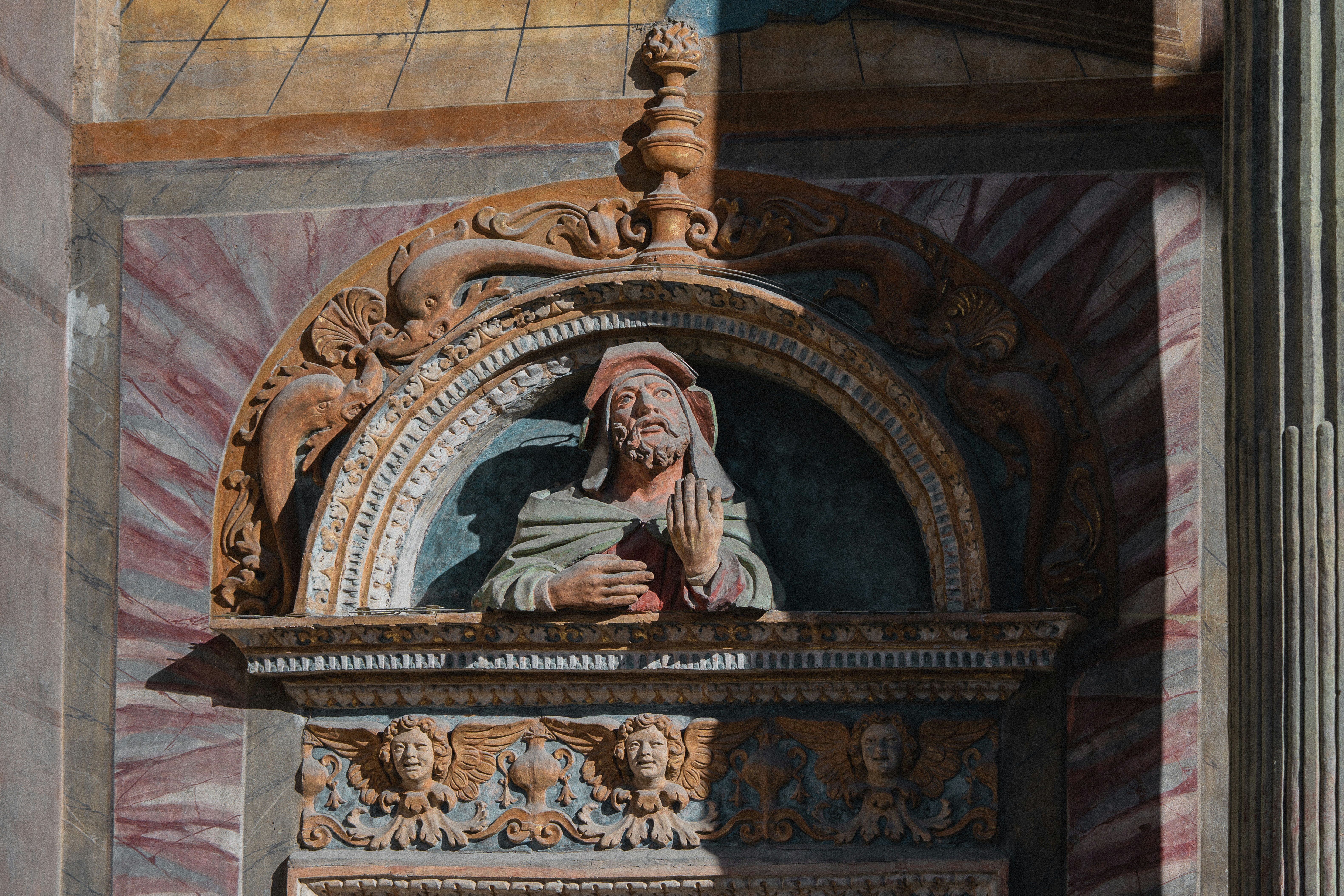 Stone Shrine: A Bearded Saint Reaching Out from Ornate Arch
