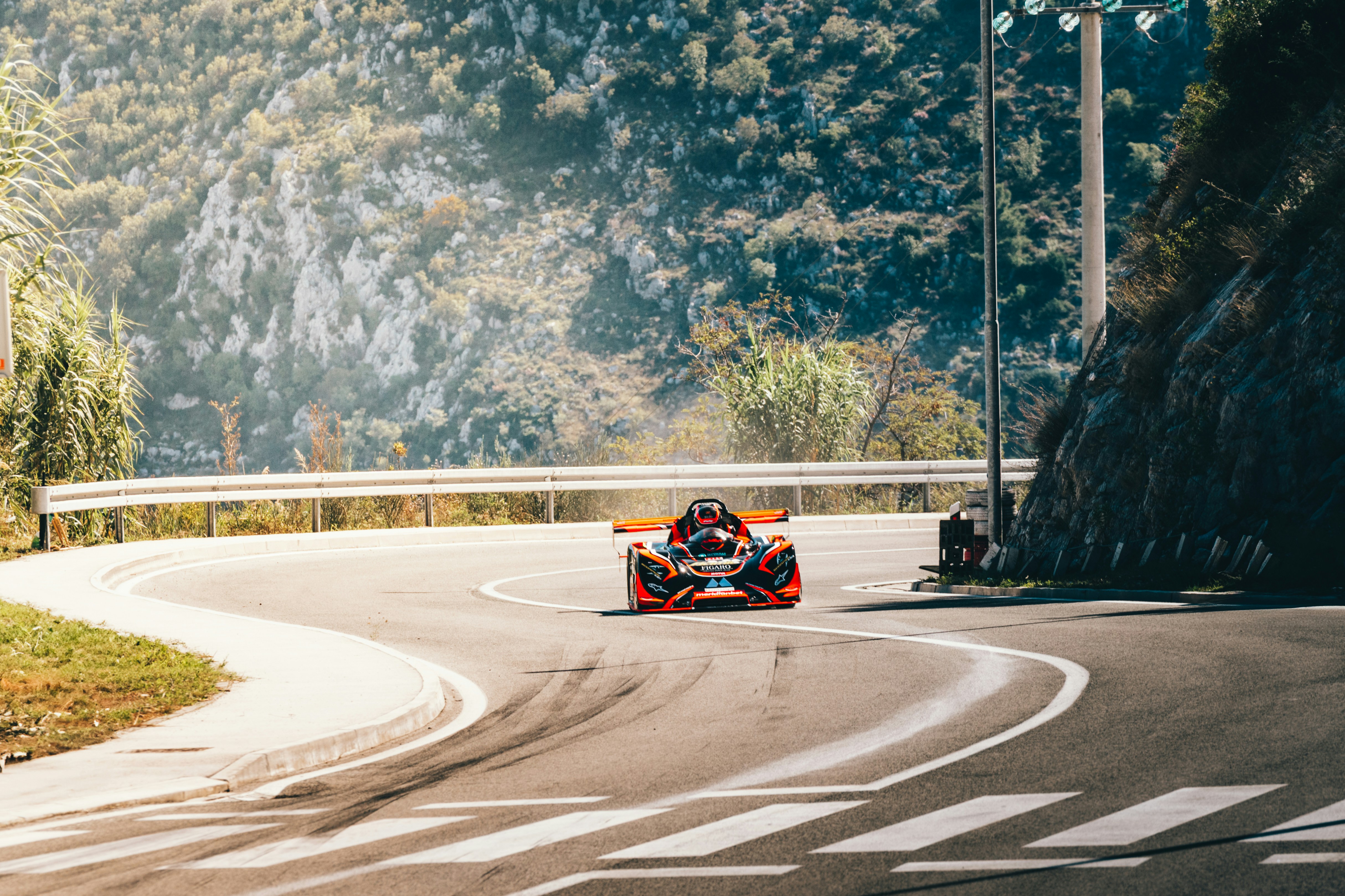 Open‑Road Racer: A Solo Car Tackles a Hairpin Descent