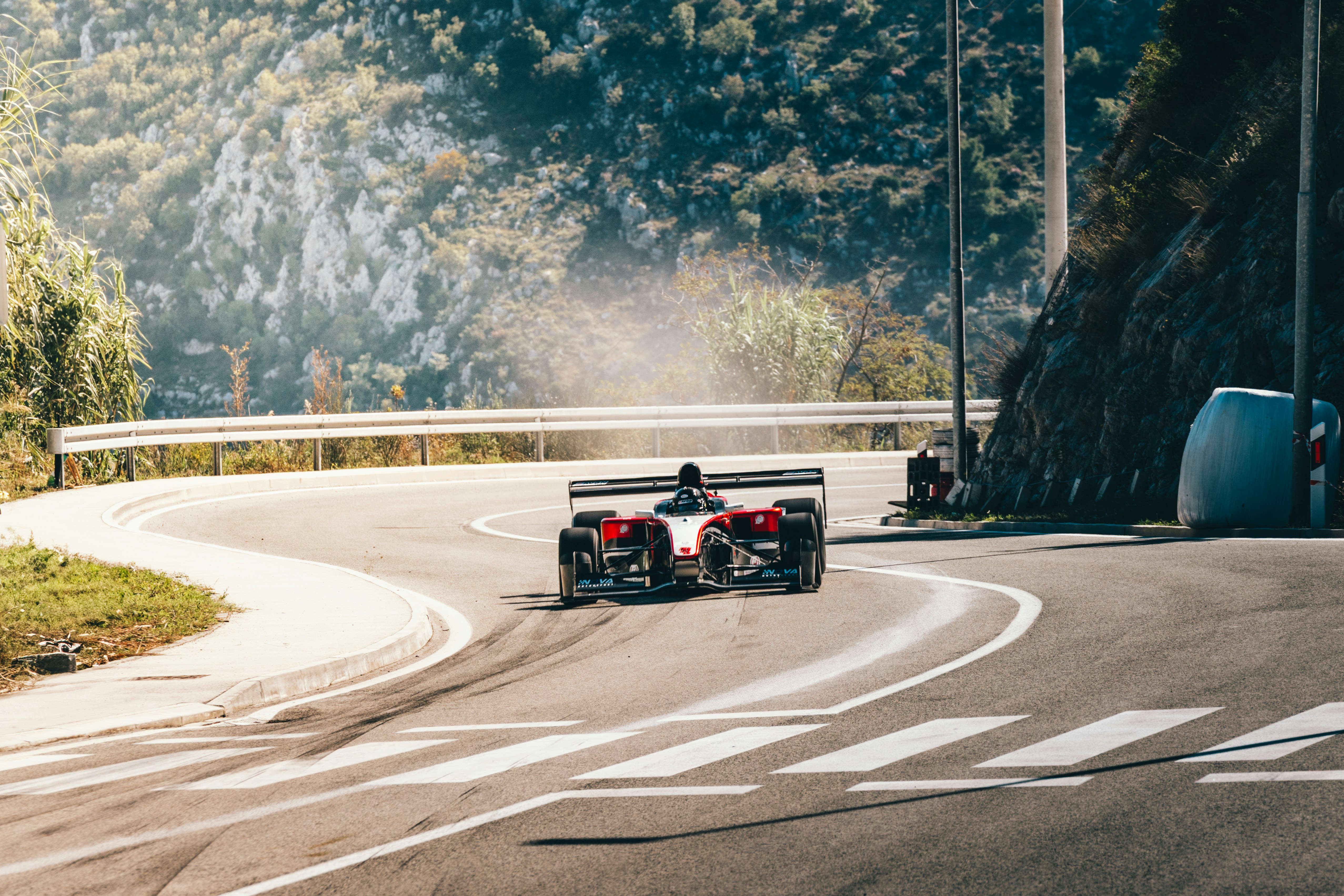 Car Snaking Through a Winding Mountain Road