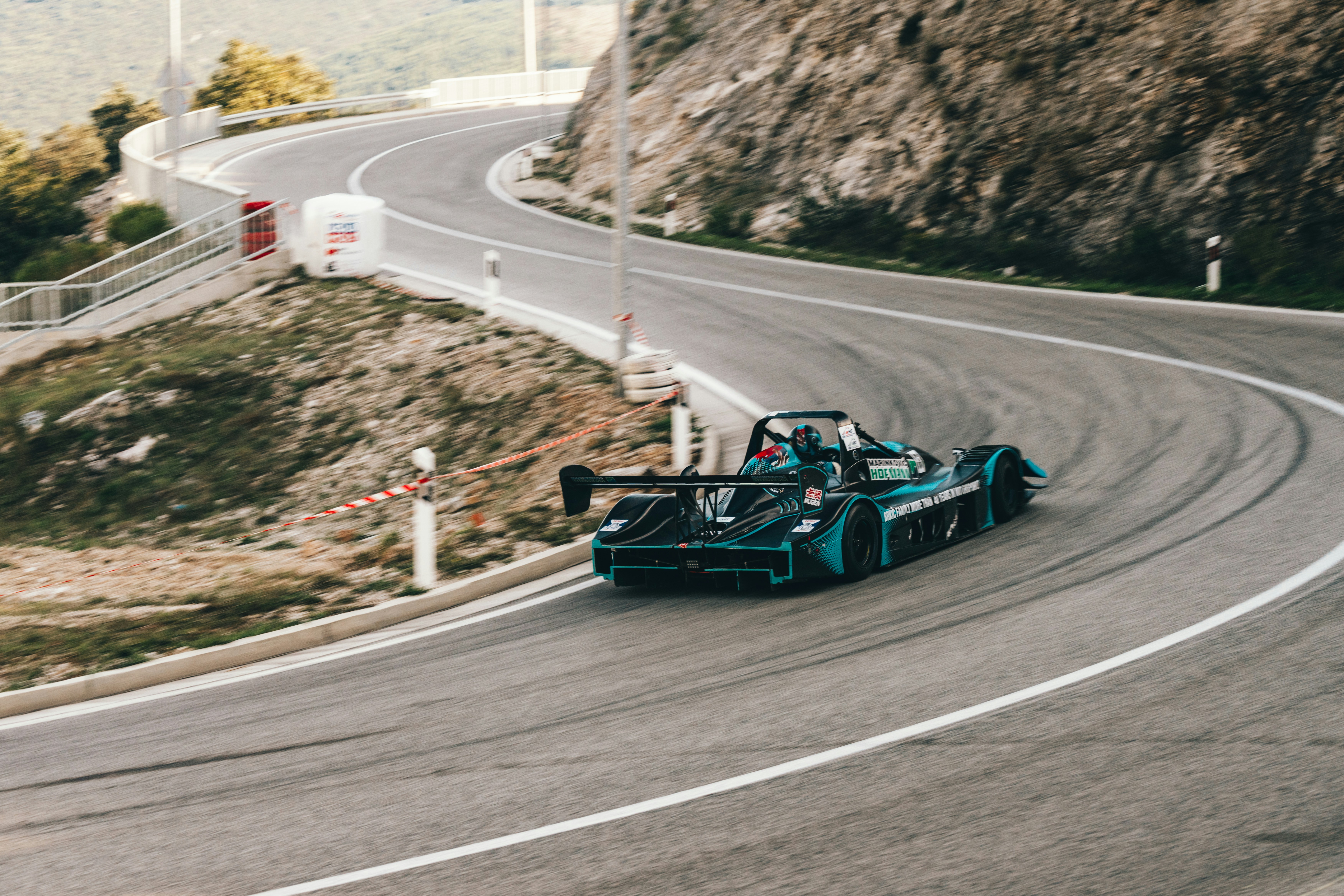 Serpentine Rally: A Hypercar Clings to the Hairpin Amid Coastal Roads