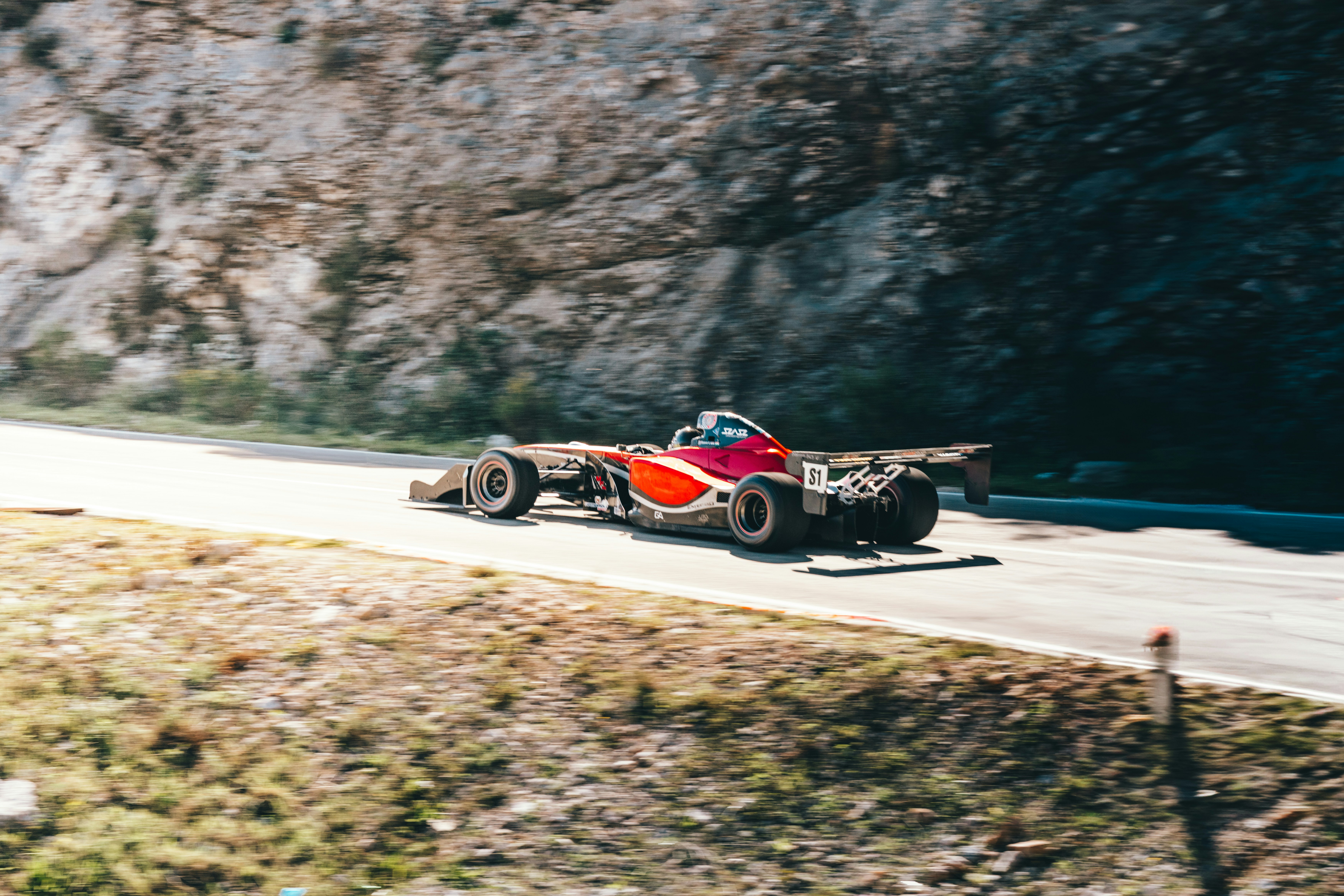 Red Formula: A lone racer carves through sunlit switchbacks