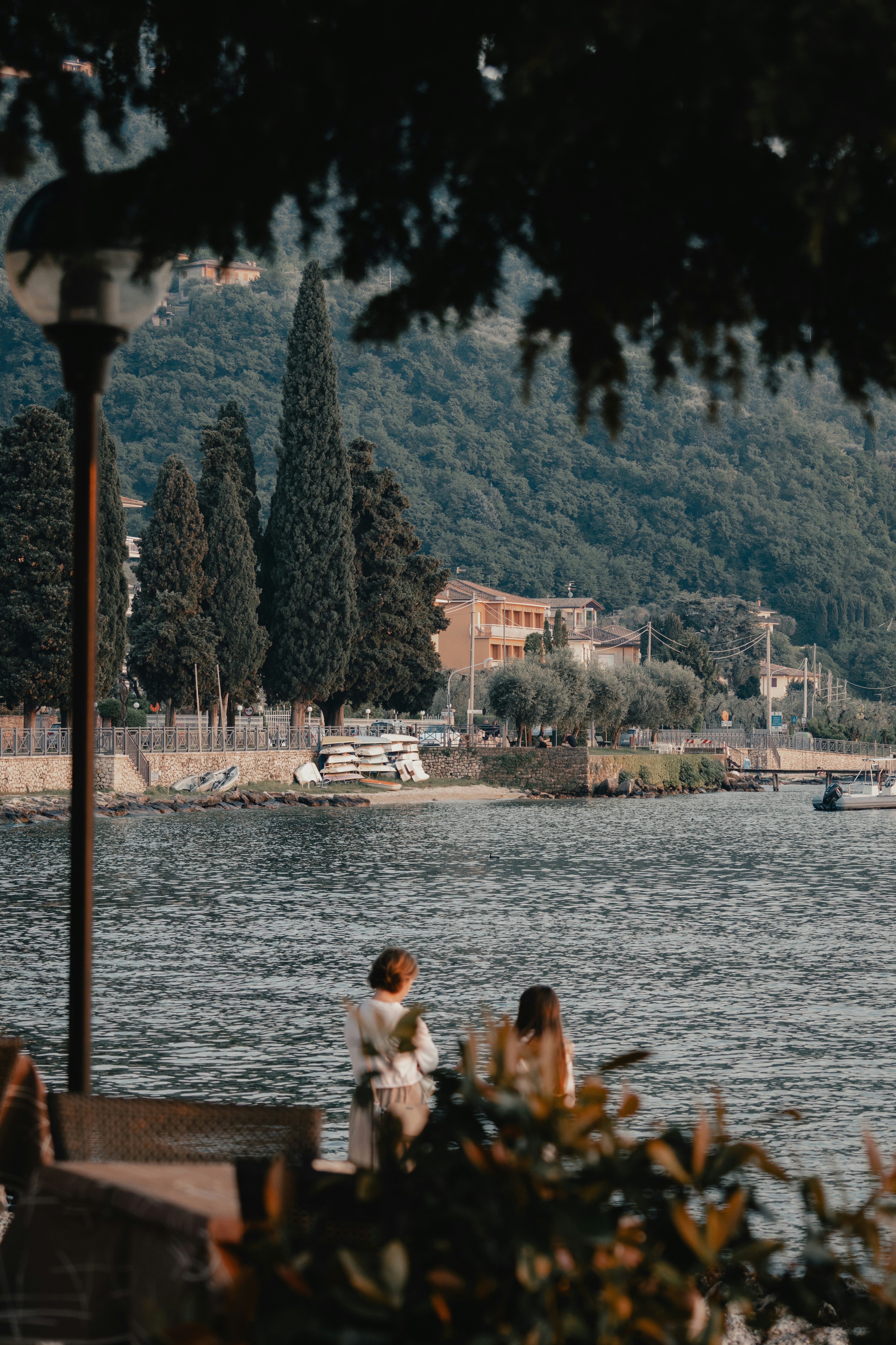Lakeside Quiet: Figures in the Shoreline Glow