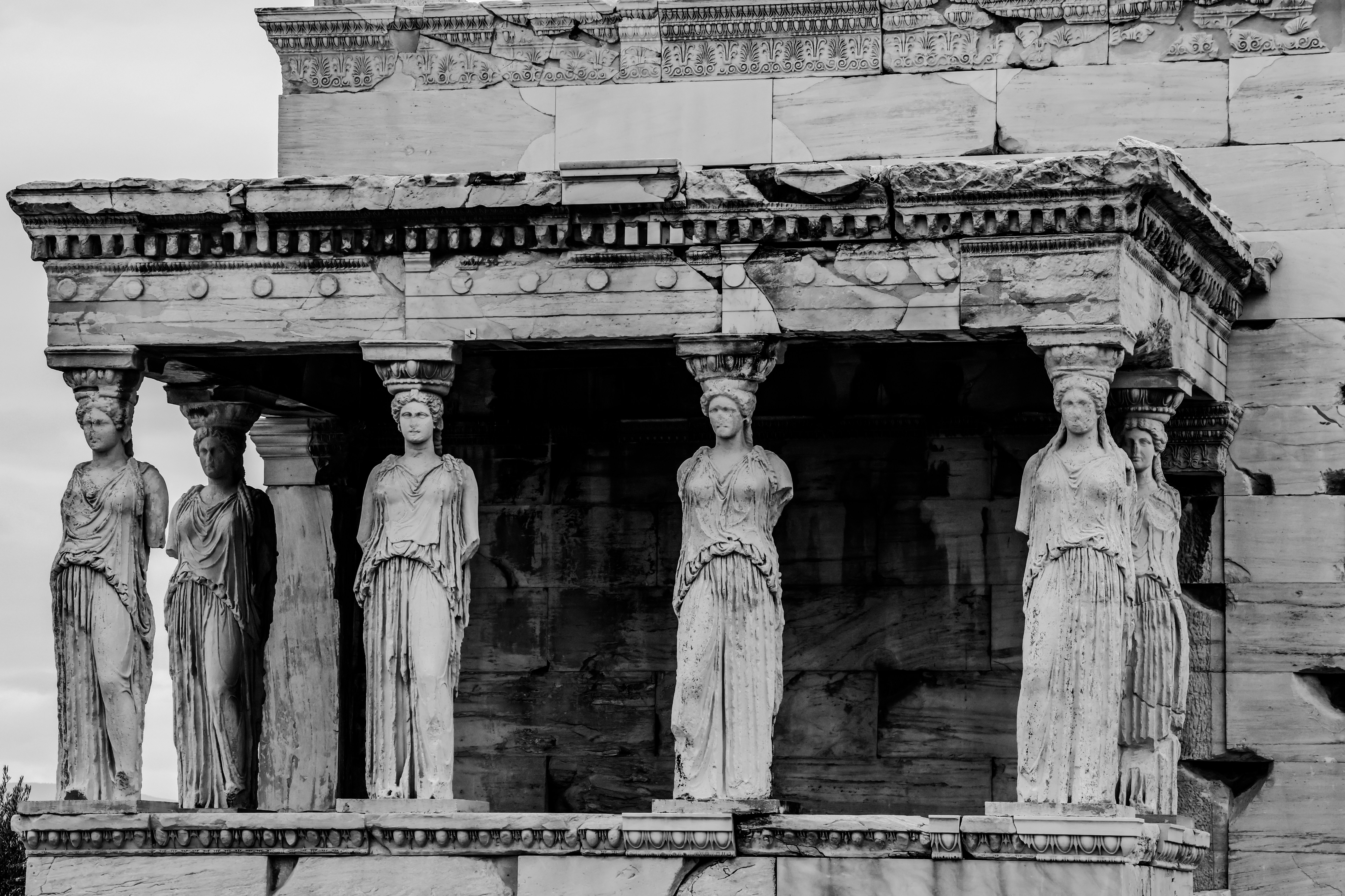 Stone Chorus: Carved Figures Guarding the Frieze