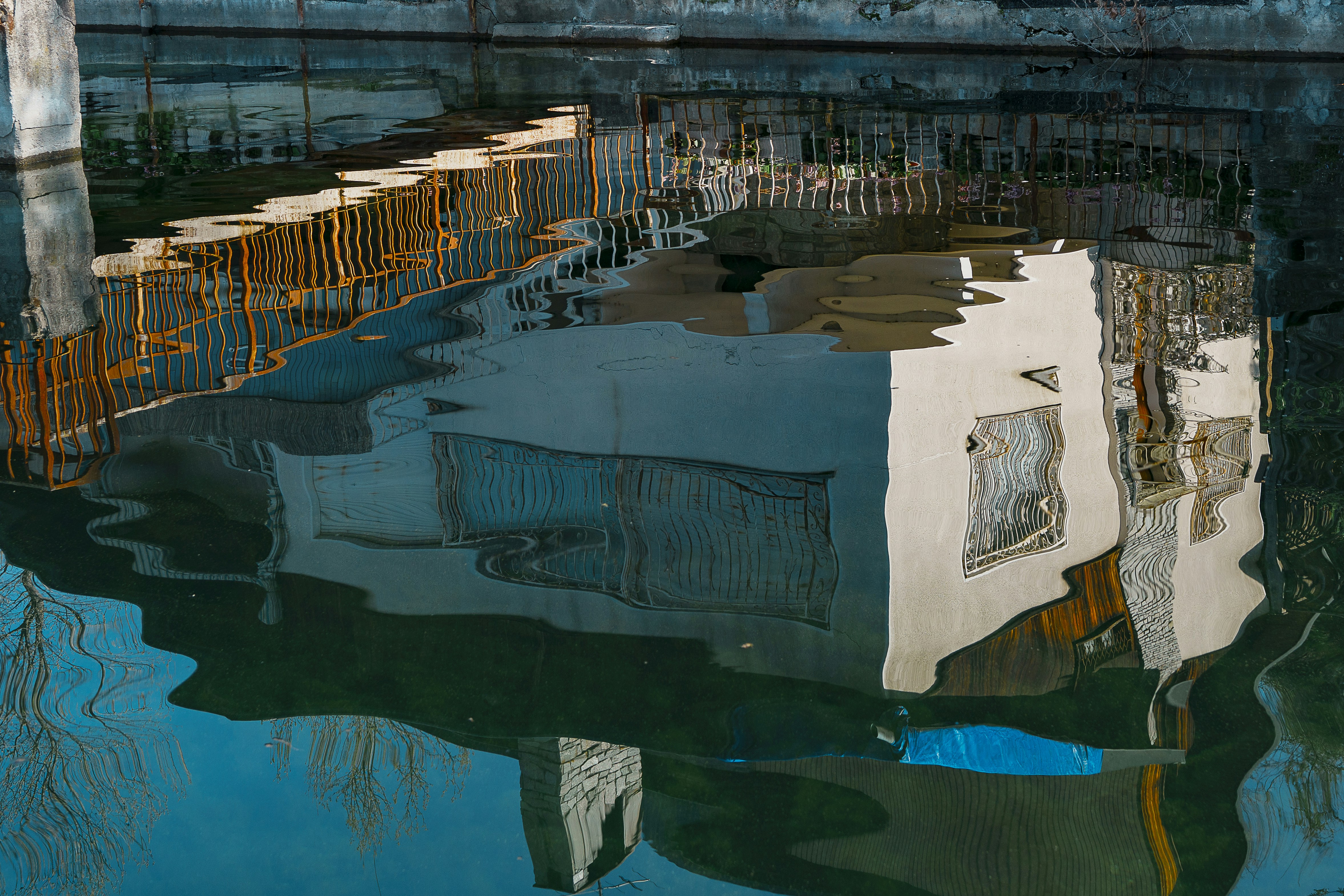 Liquid Mirror: Building Facades Reflected in Quiet Canal