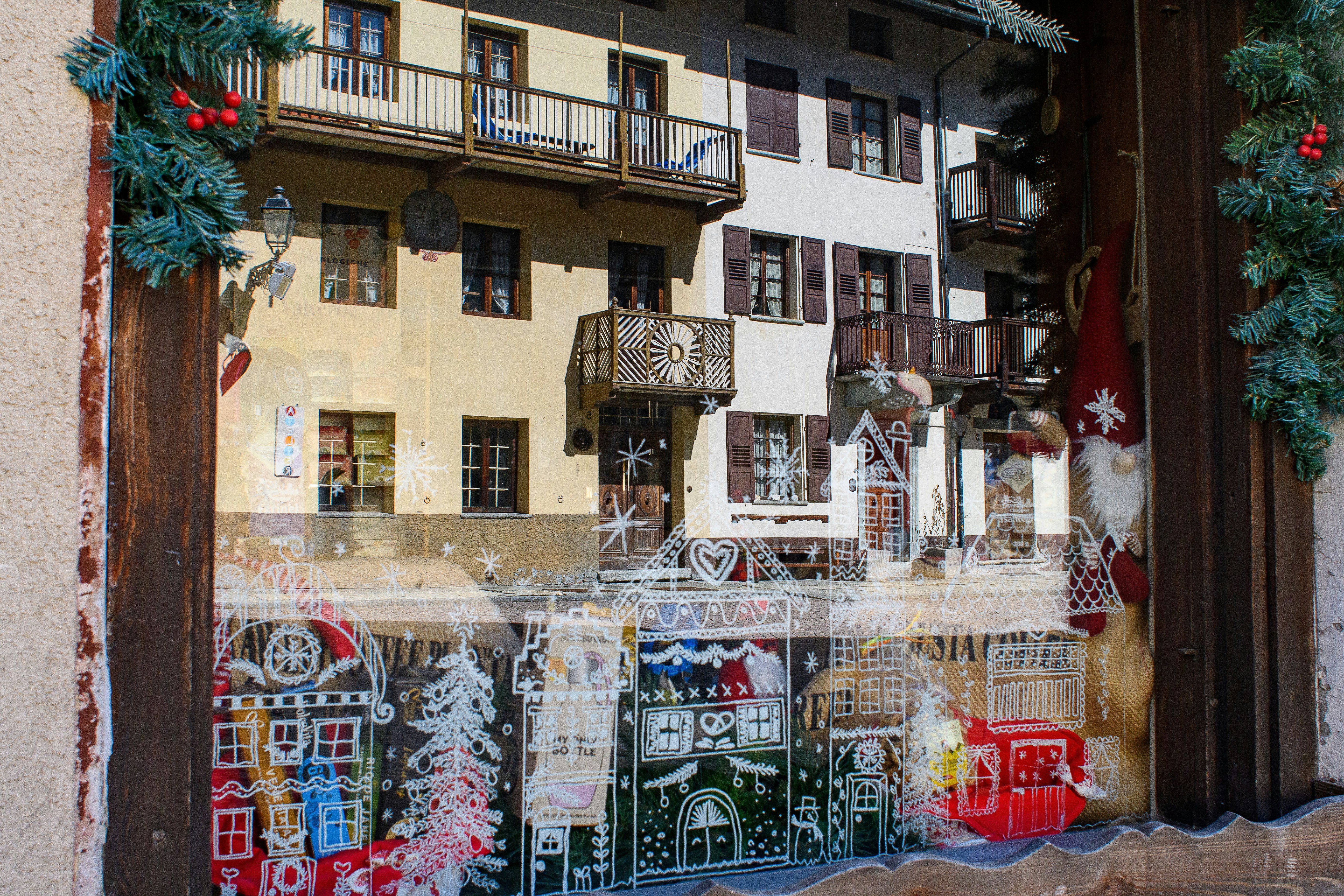 Festive Alpine Window: A Street of Painted Snowy Motifs