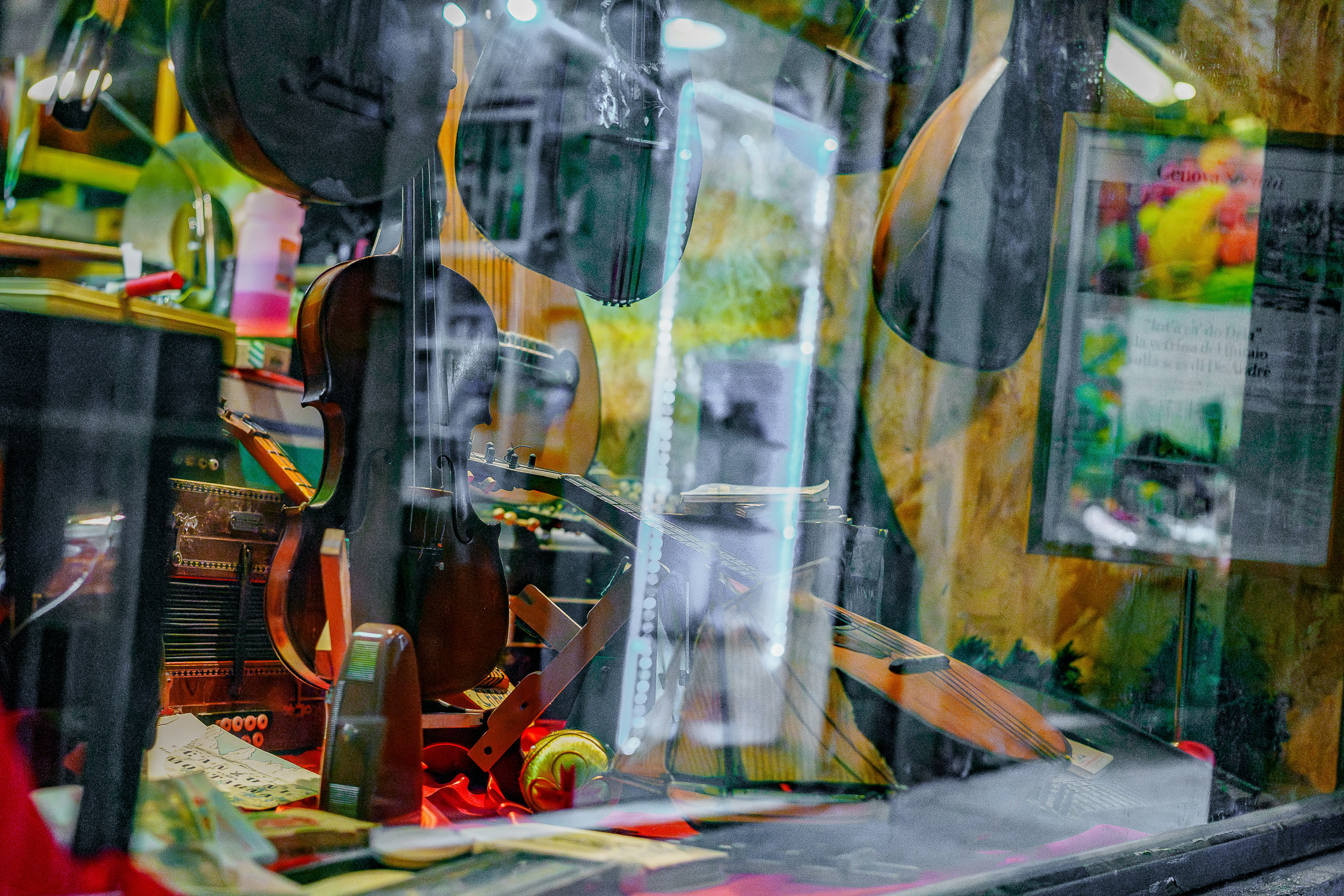 Strings and Reflections: a cello shop window through glass and glare