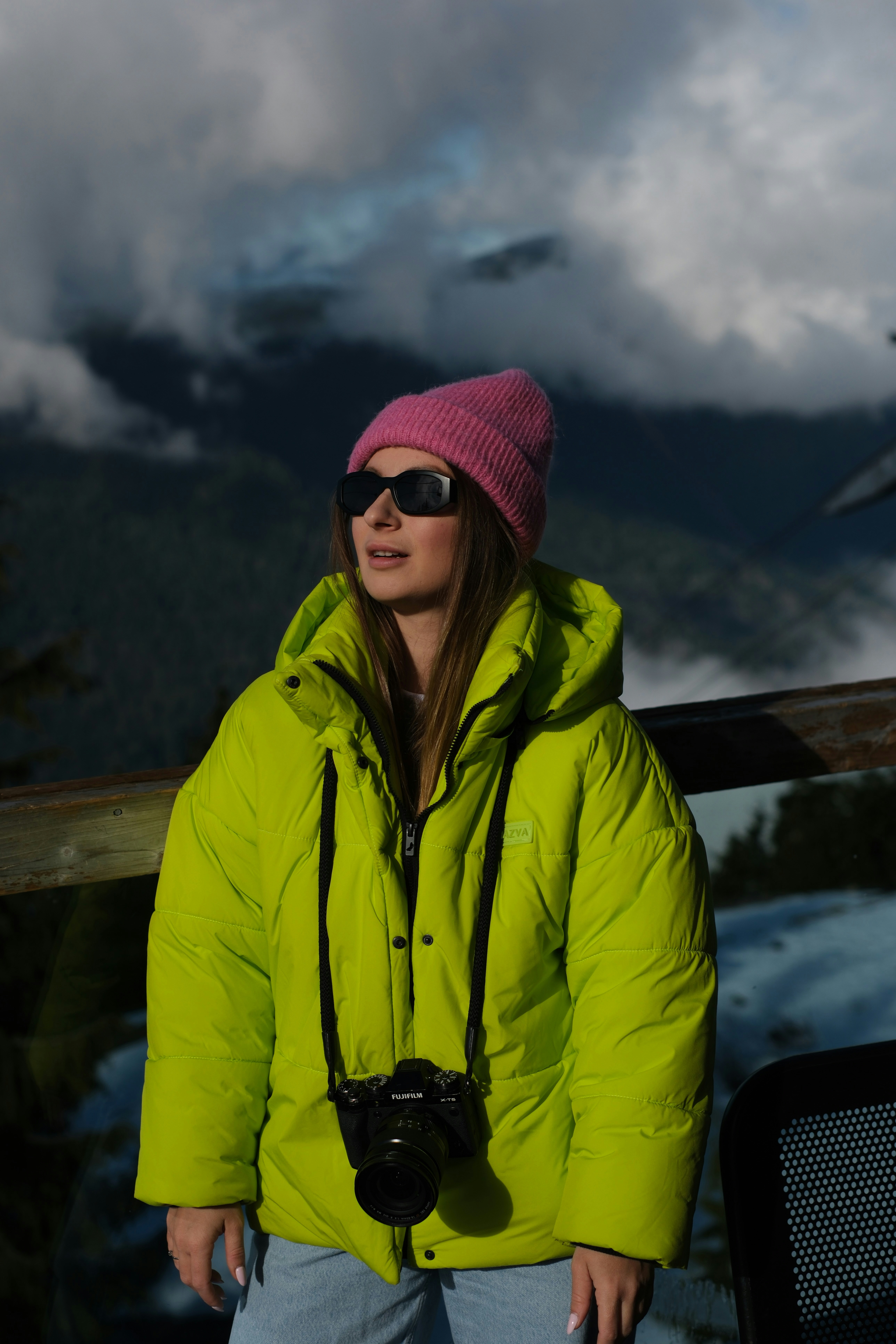  neon pink beanie meets mountain air: a portrait in lime puffer
