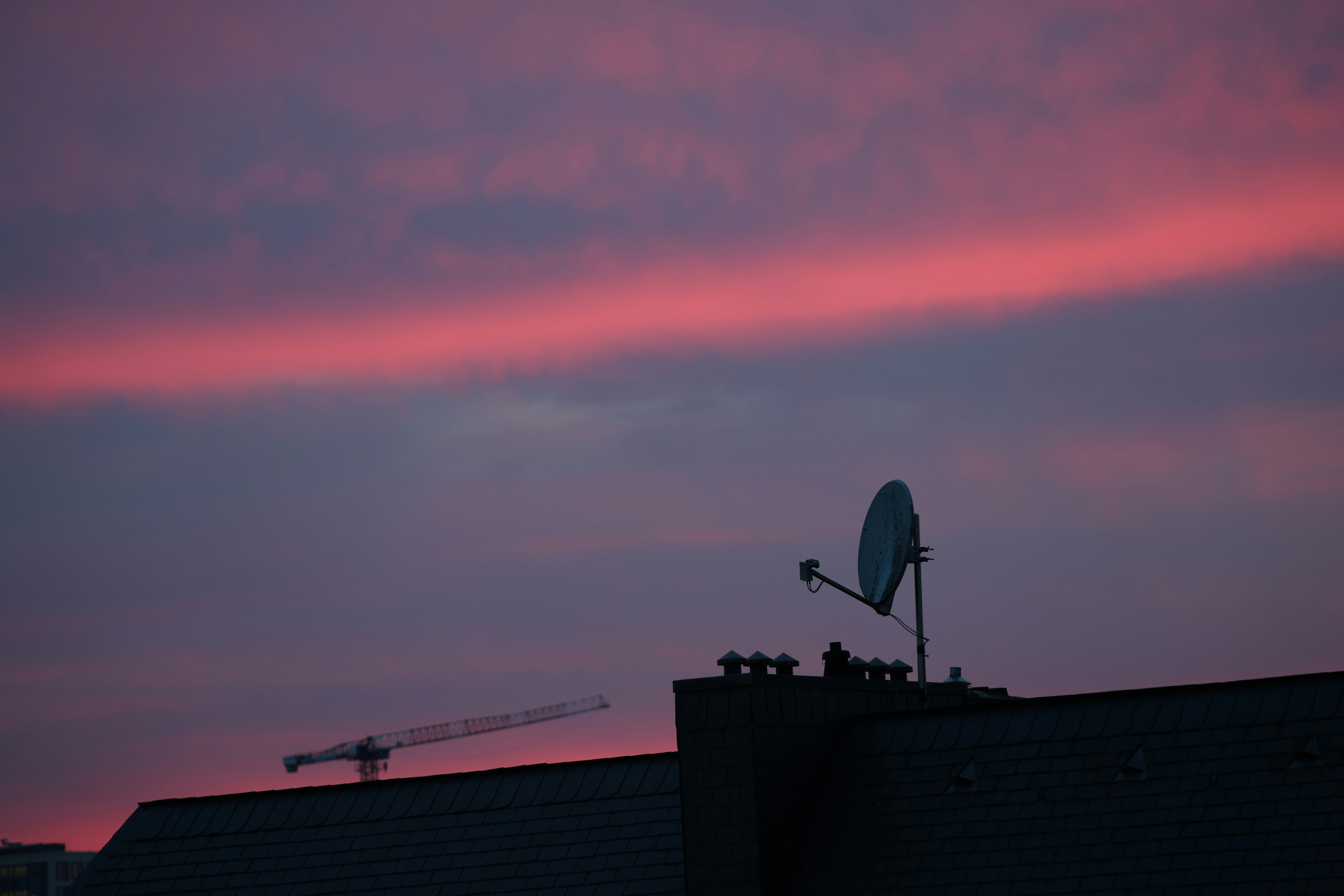 Rooftop Silhouette Under Dusky Sky