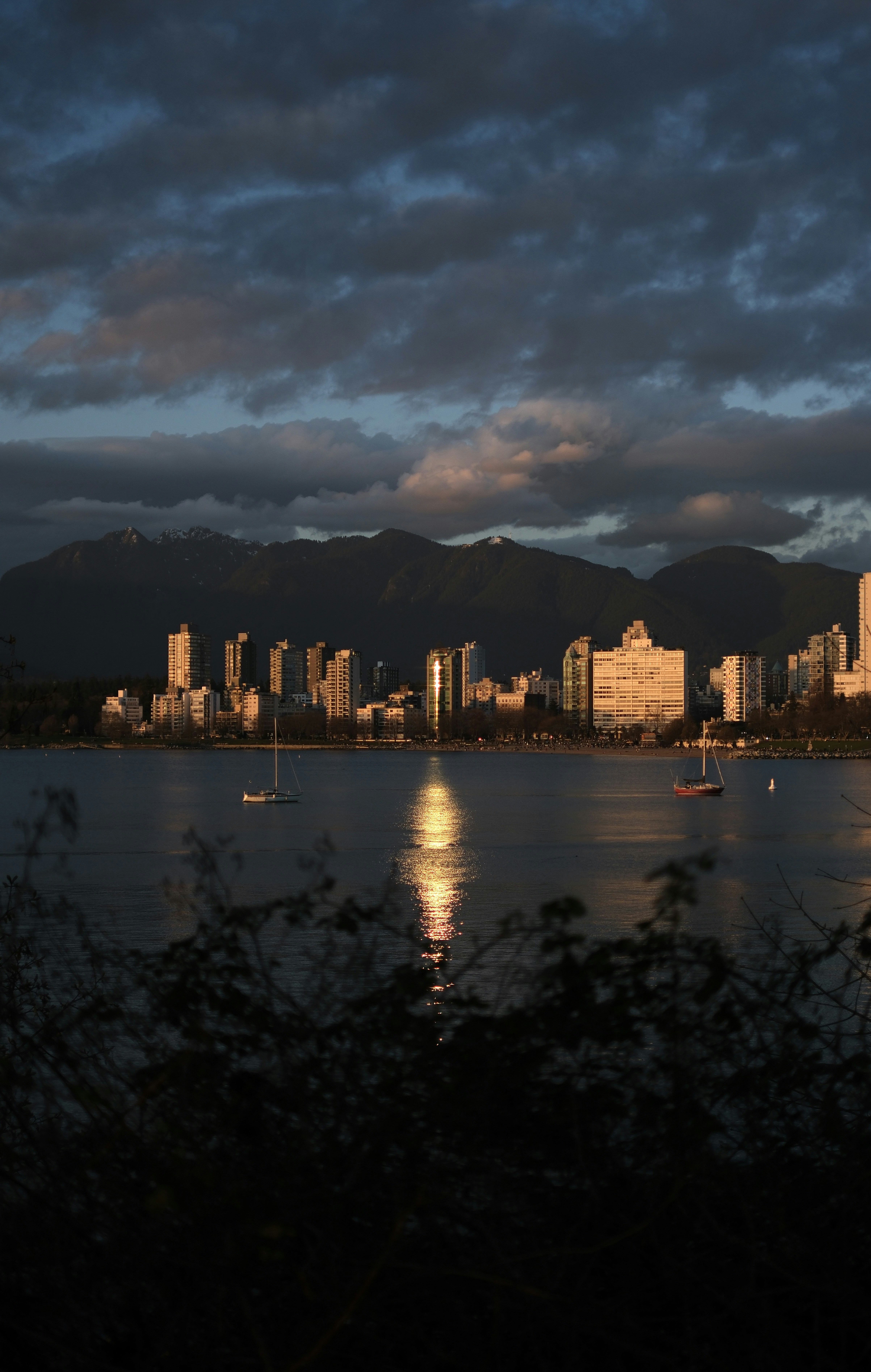 Evening Lights on the Waterfront: City Silhouette and Reflections