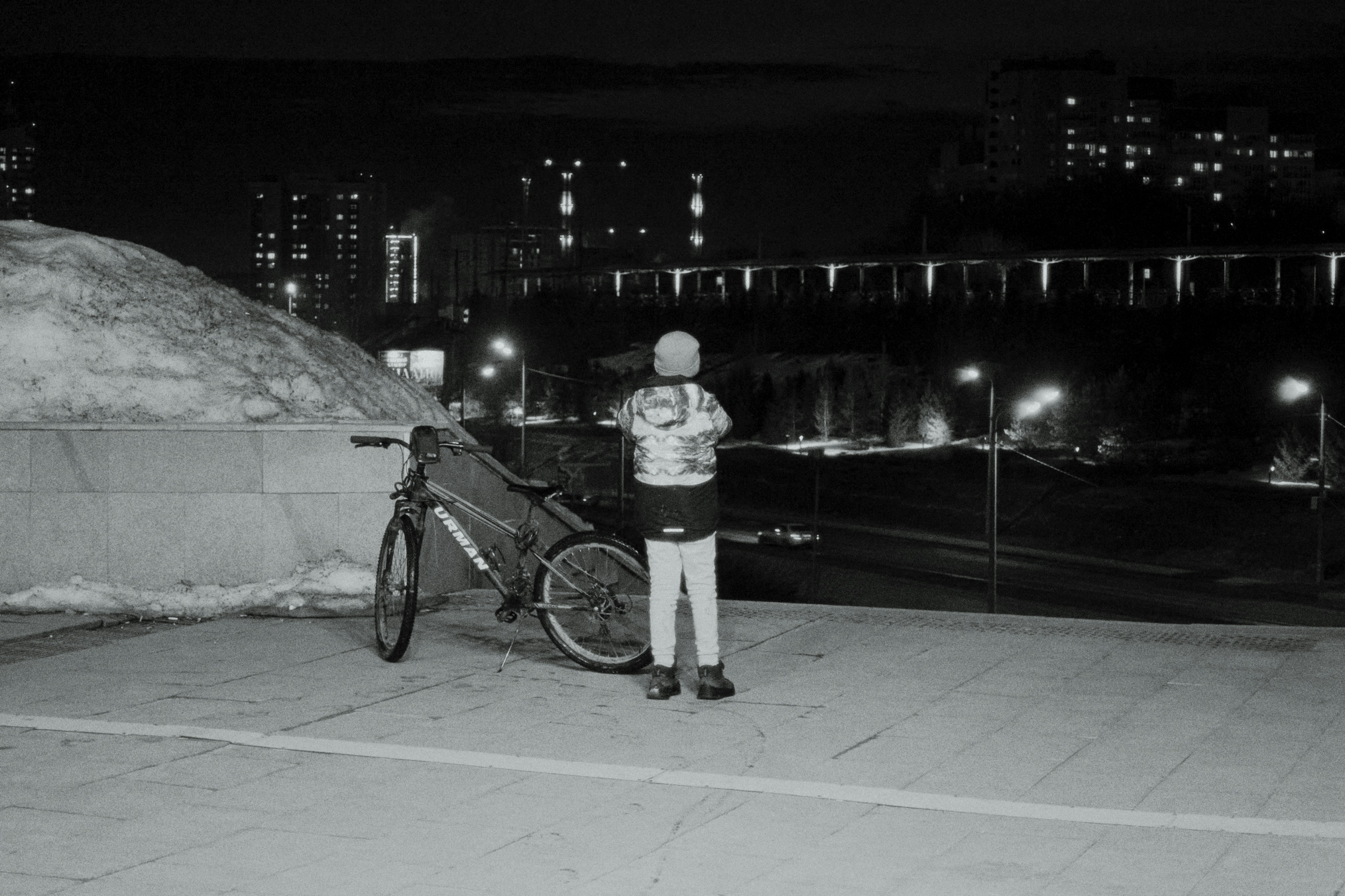 Night rider and silent cityscape