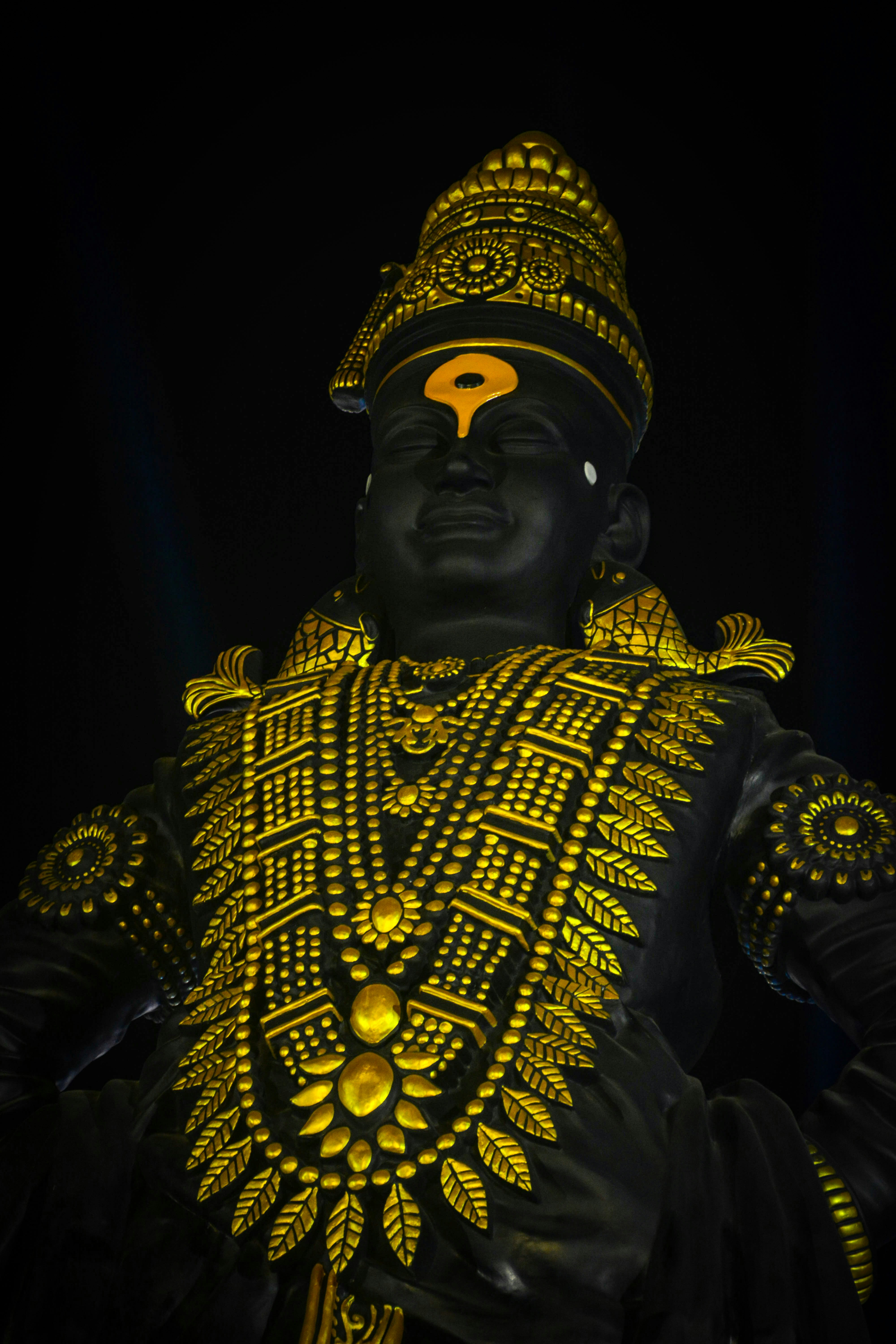 Gilded Silence: A Night-Styled Statue Immersed in Shadow and Light