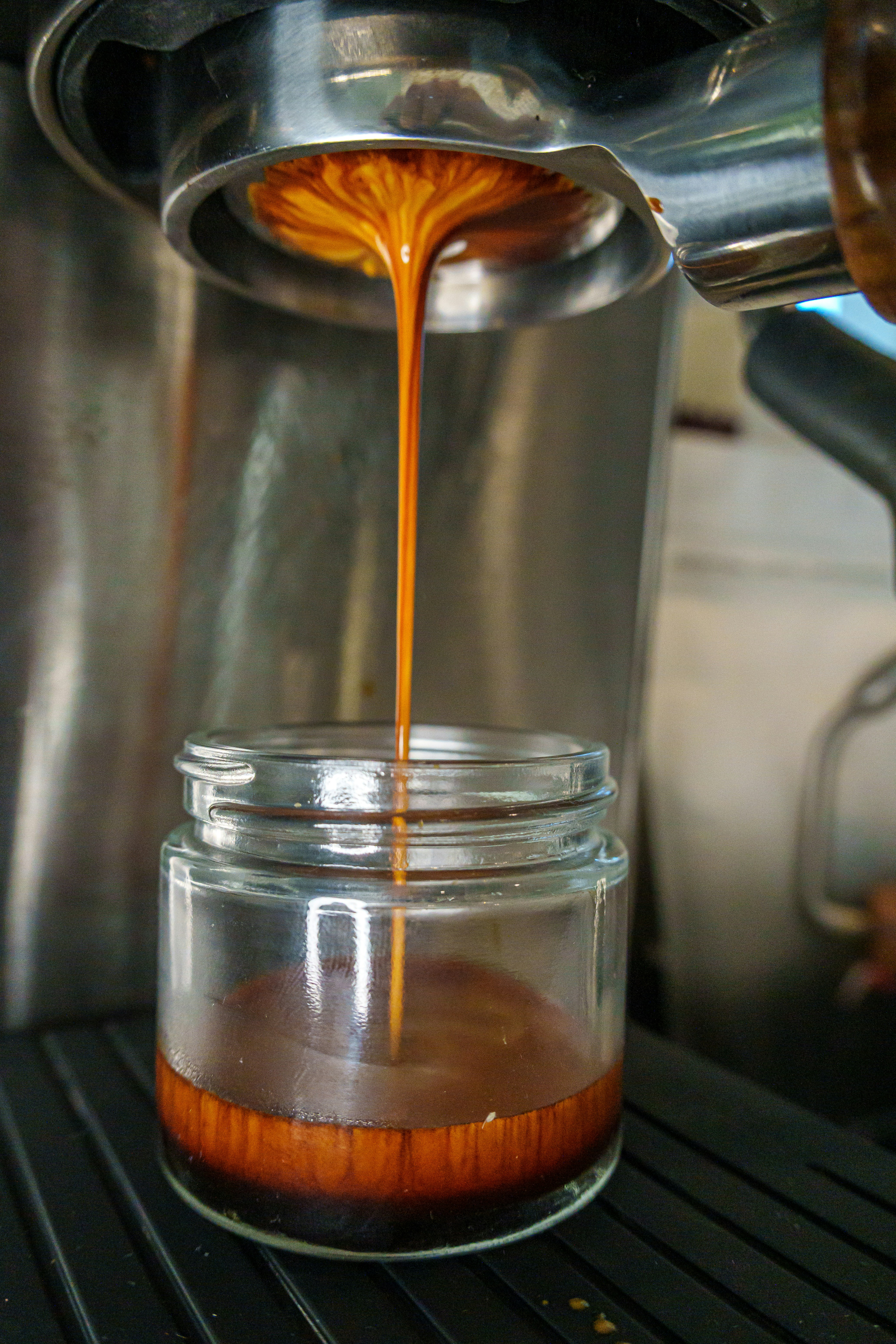 Flowing Espresso Orbit: Currents of Coffee from Spout to Jar