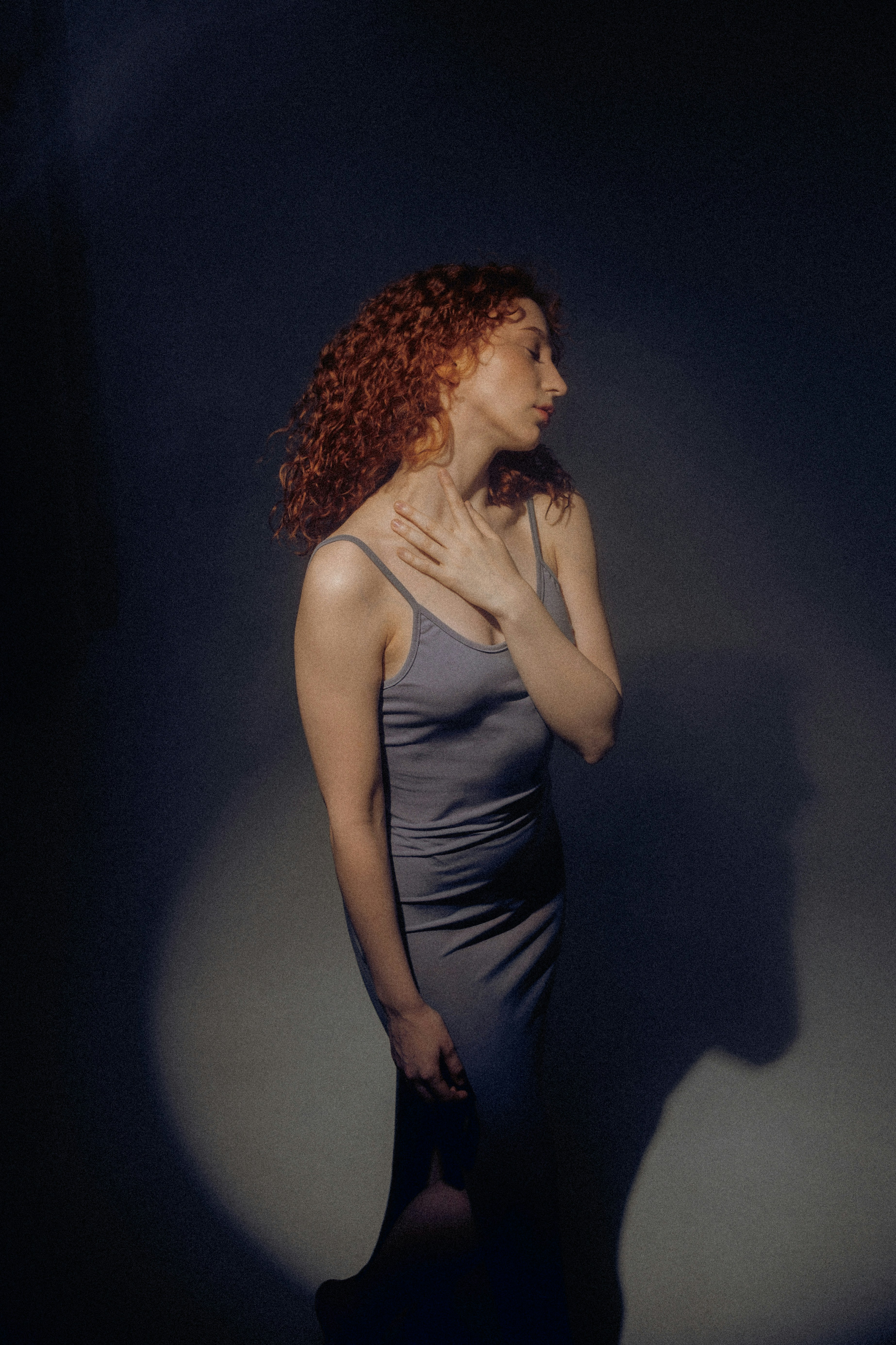 Spotlight on Grace: A Poised Silhouette in Nightfall