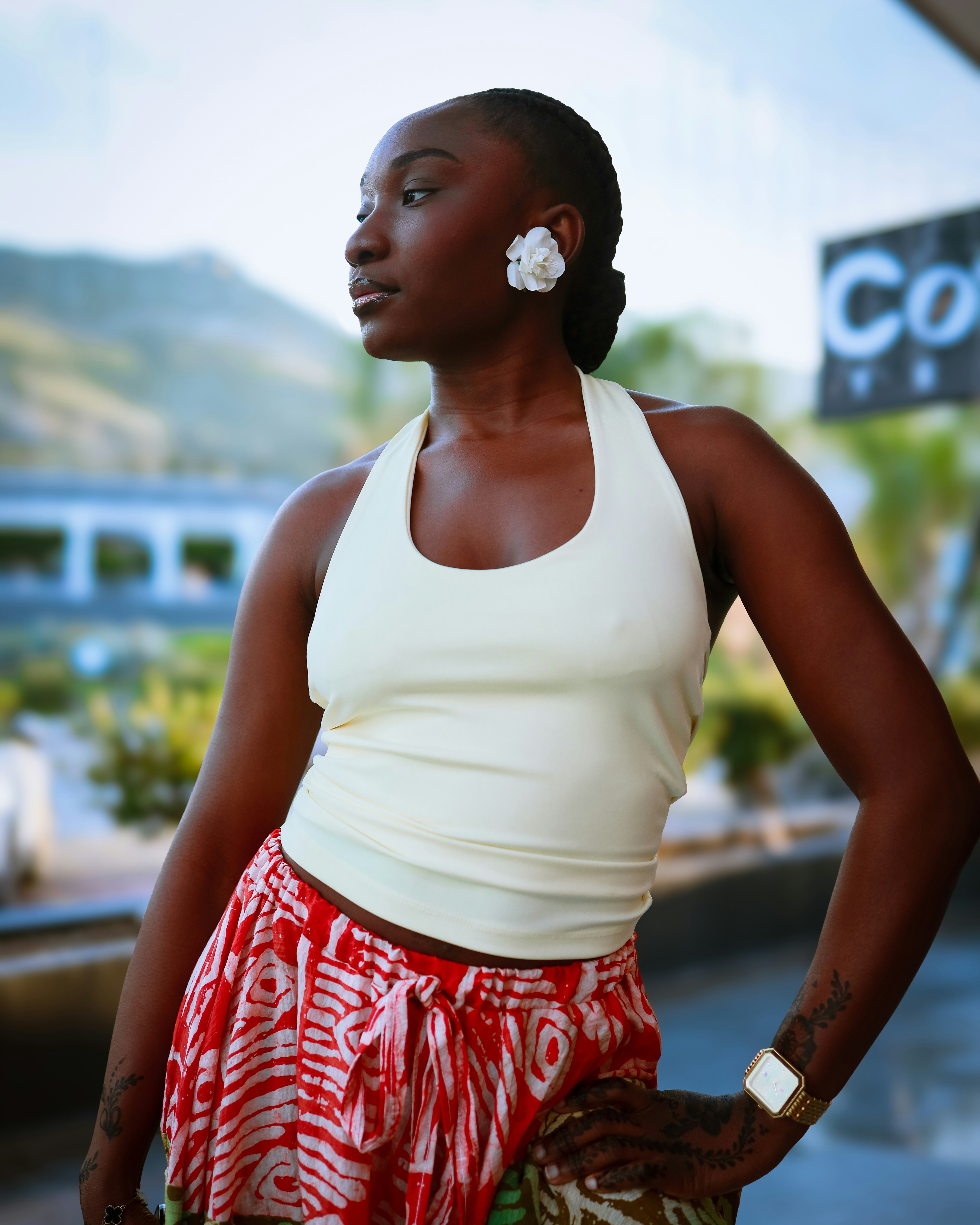 Graceful Pose Under City Light: A Portrait in White and Red