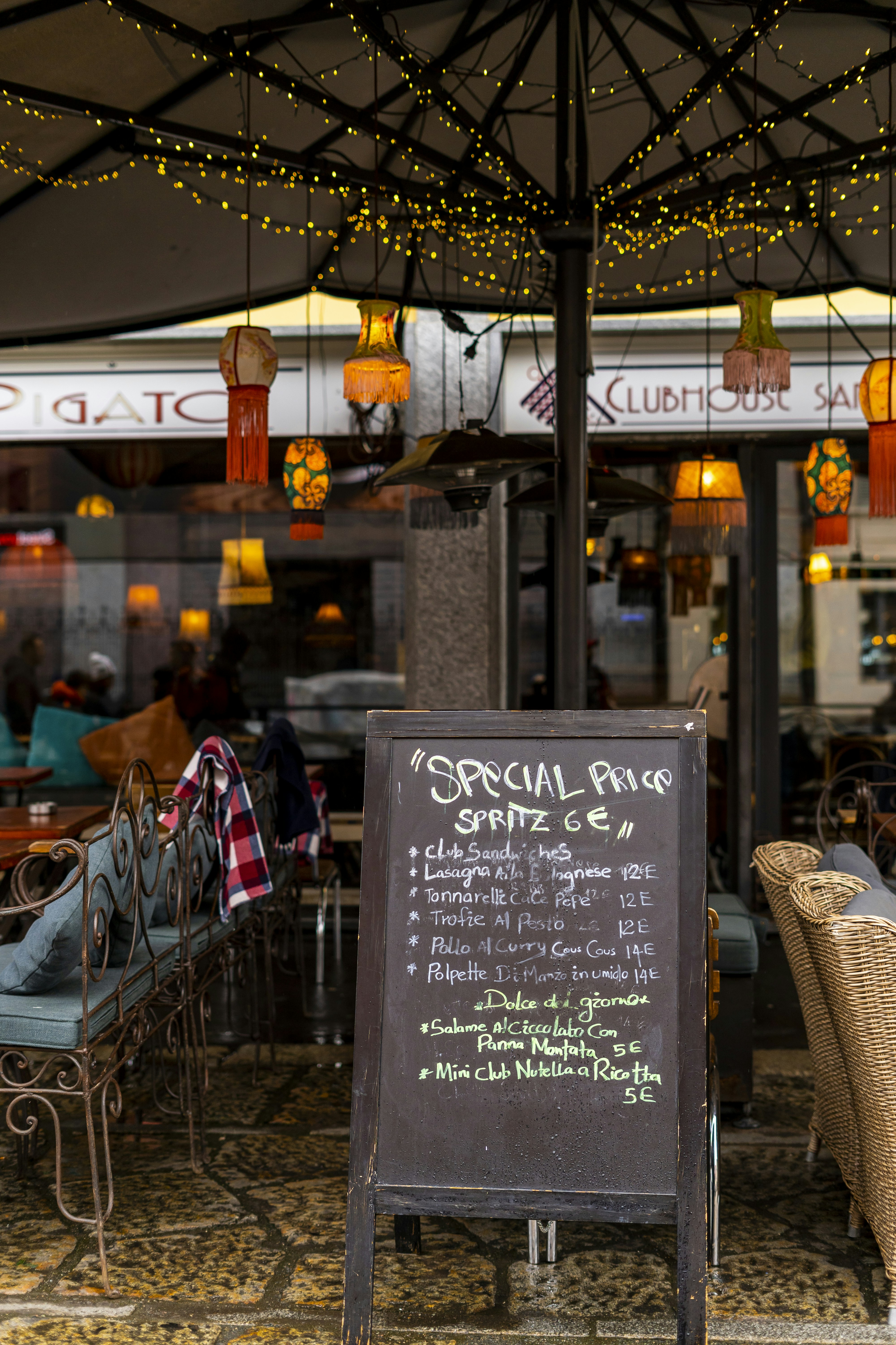 Chalkboard Menu Under Festive Lanterns in a Cozy Café