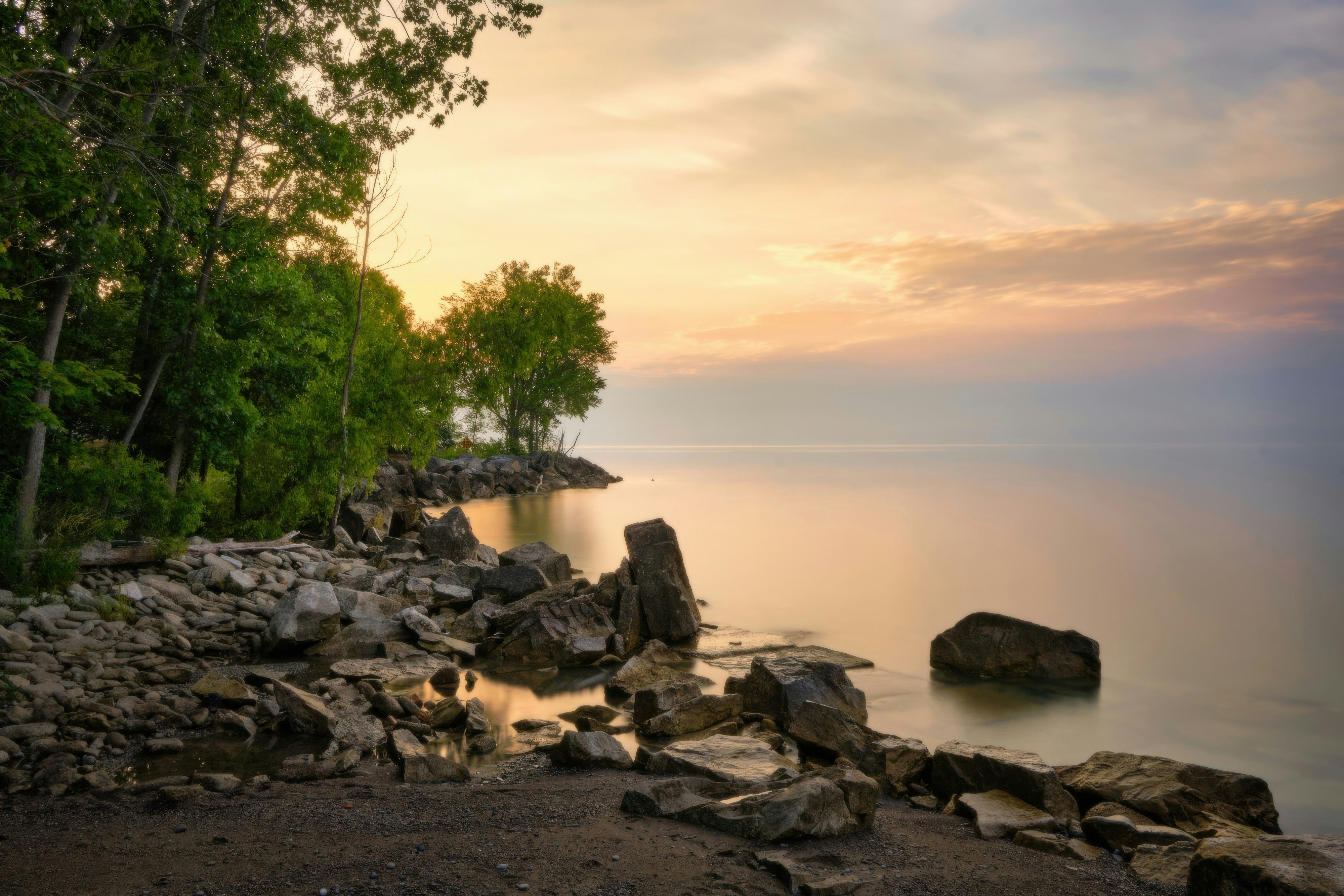 Sunset Calm Along a Rocky Lakeshore
