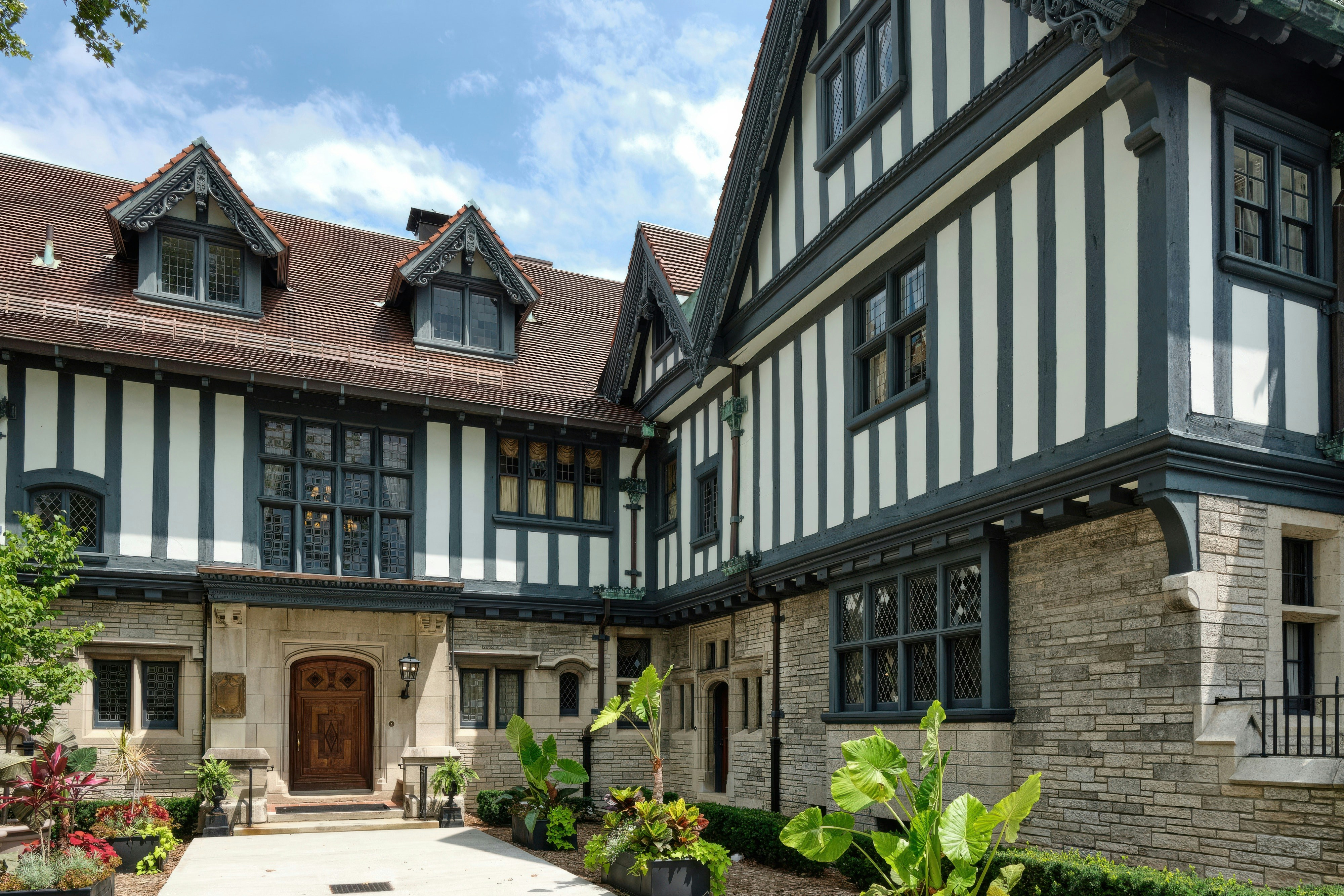 Heritage Facade: Timbered Smile over a Terraced Courtyard